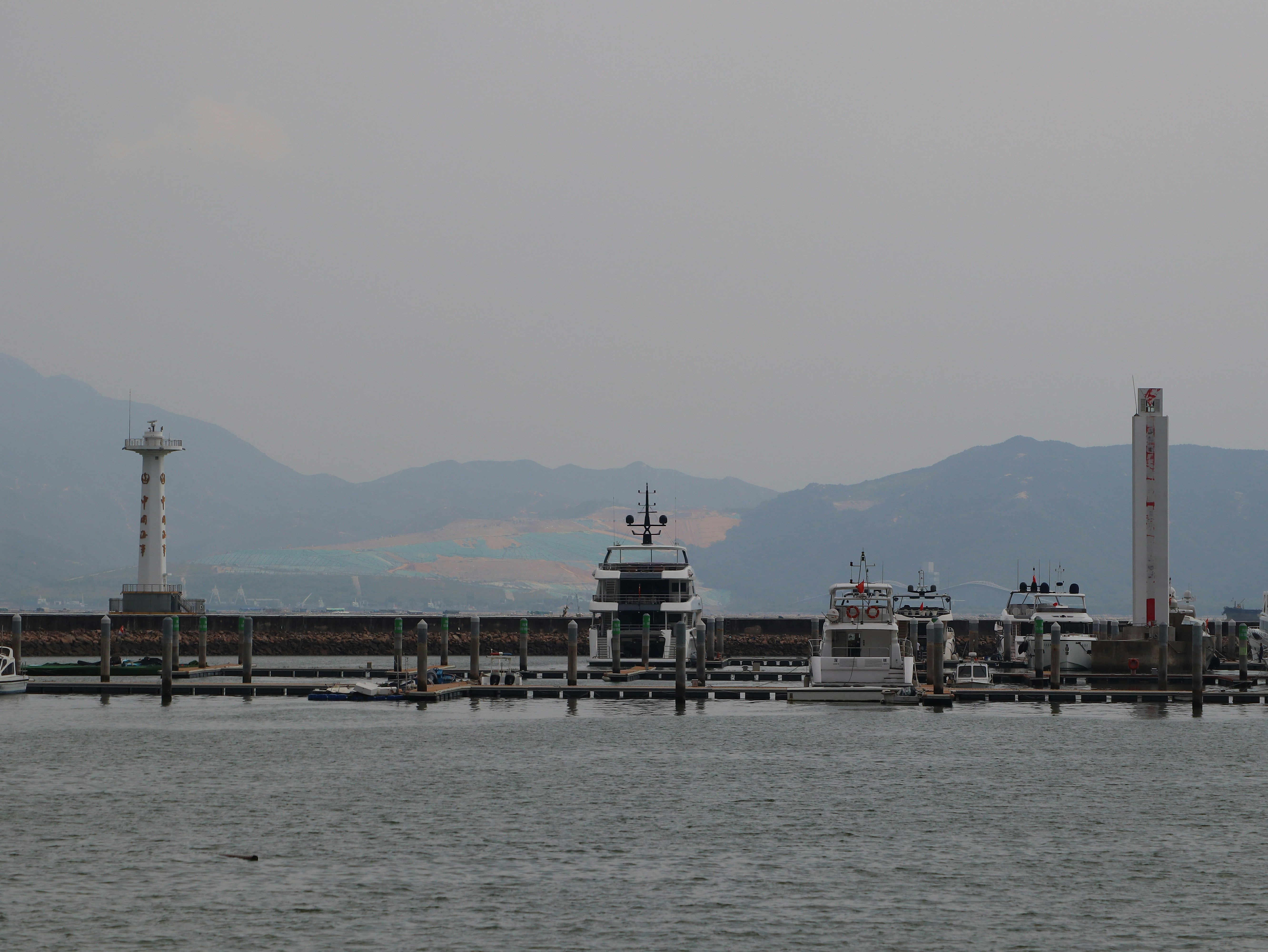 Misty Harbor: Central Ferry Framed by Docks