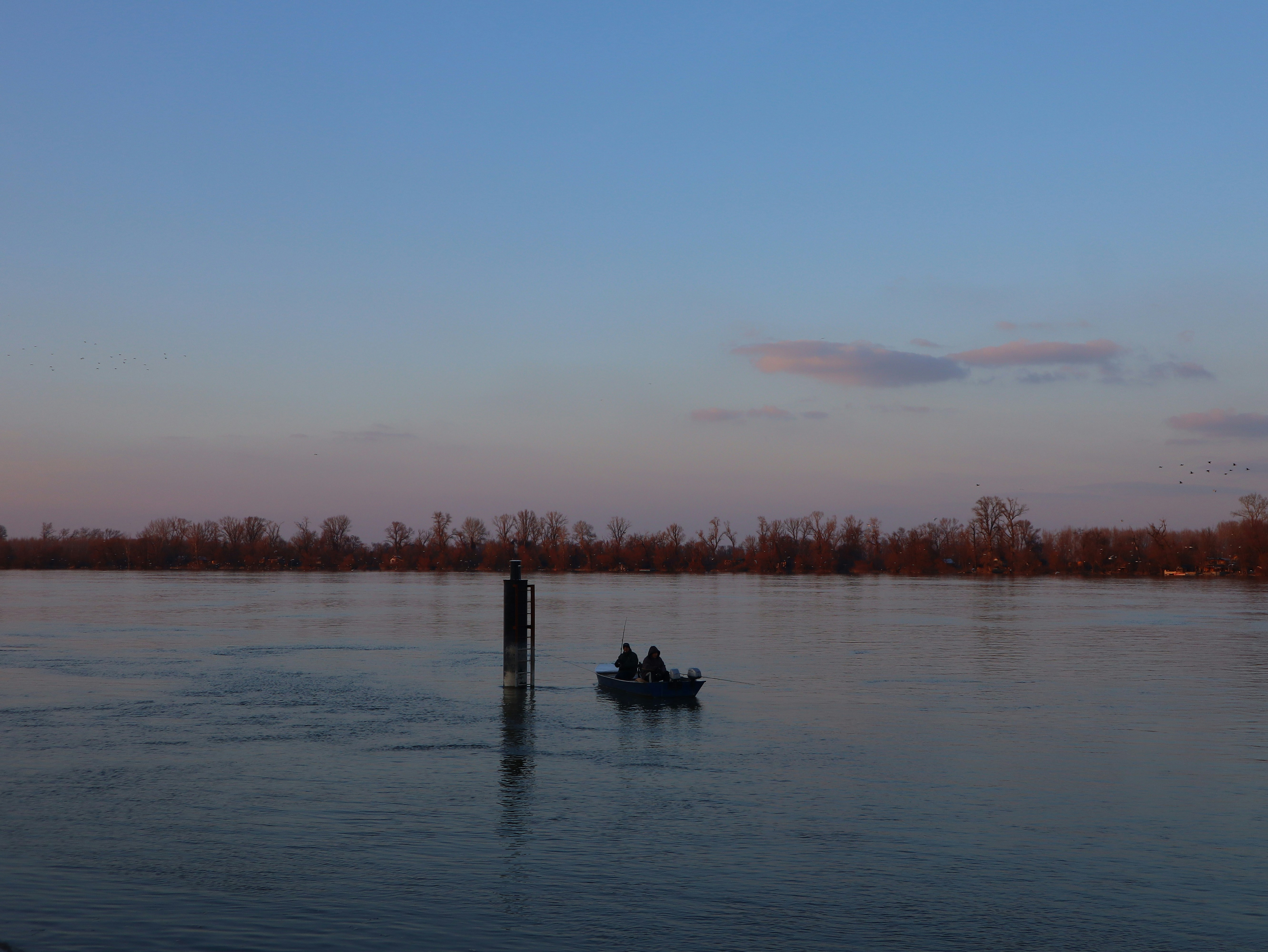 Blue Hour Riverbeat: A Lone Marker and a Quiet Boat