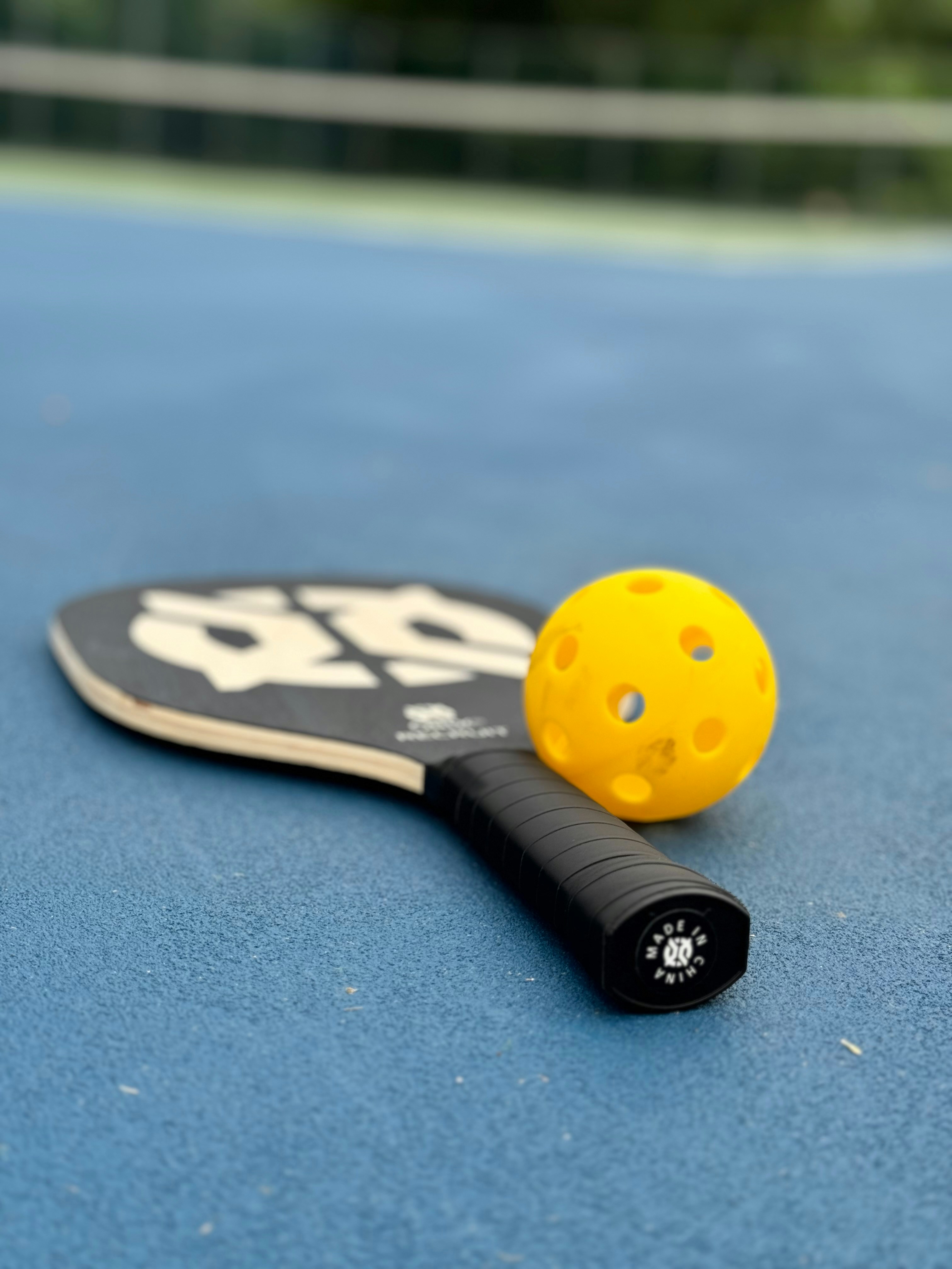 A tennis racket and ball on a tennis court photo – Free Racket Image on ...