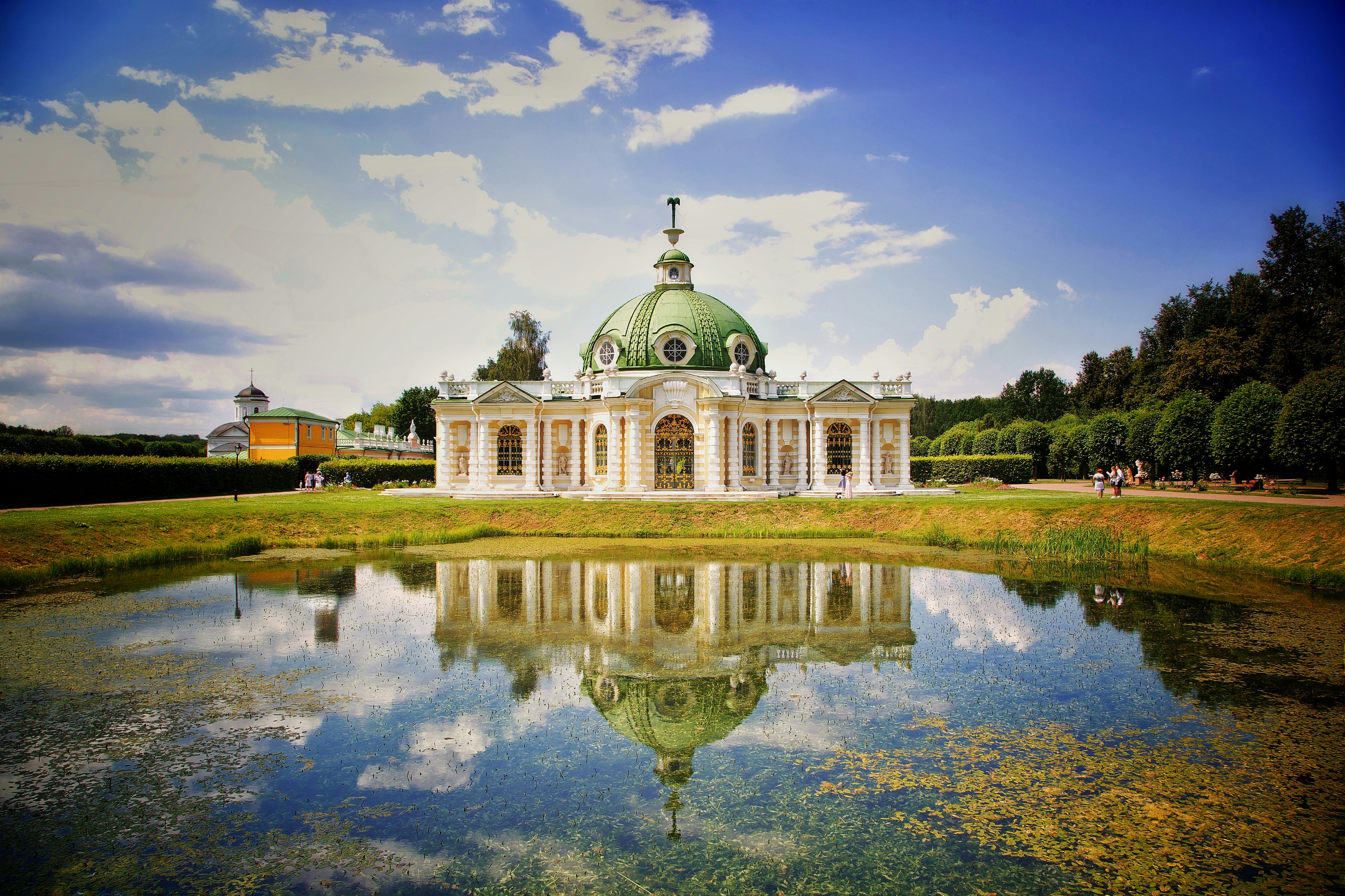 Dome and Reflection: Green Pavilion by a Quiet Lake