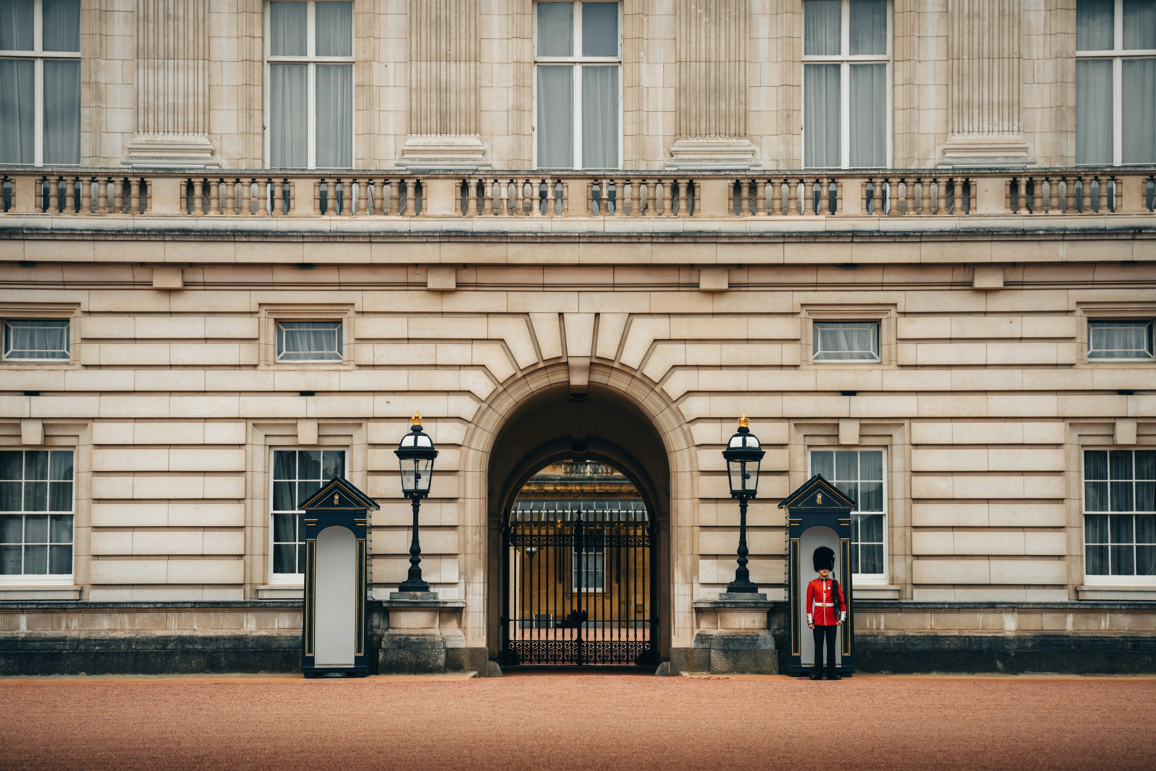 A large building with a red fire hydrant in front of it photo – Free ...