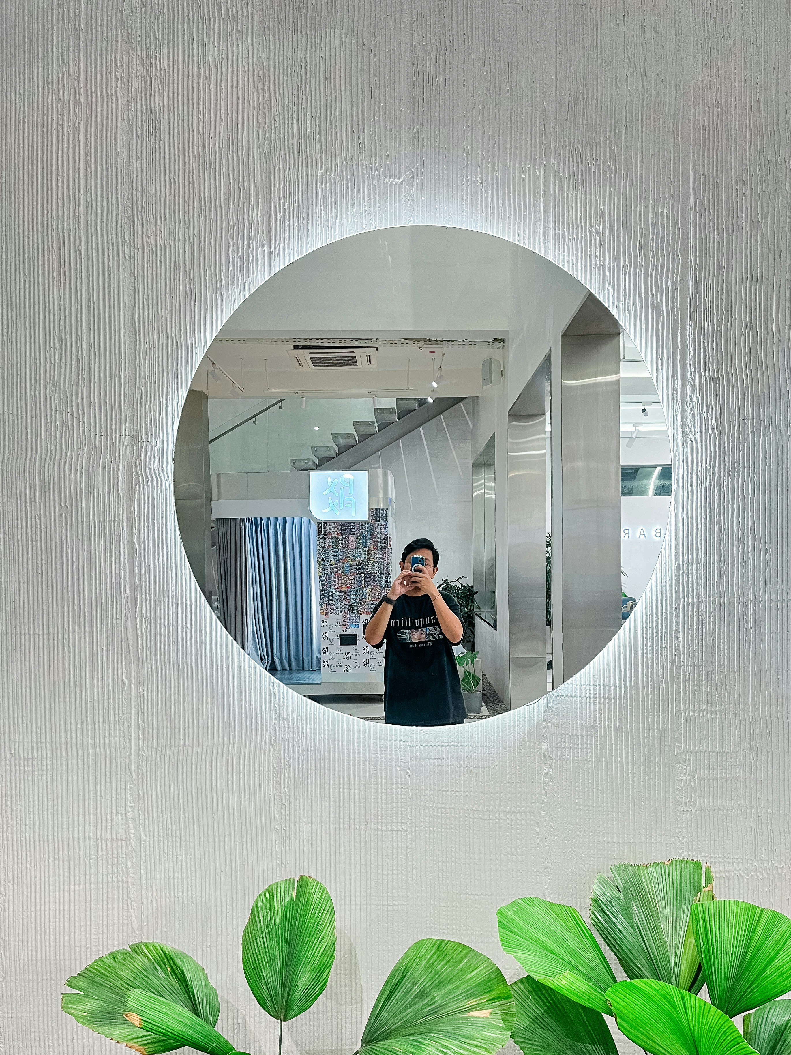 Halo Selfie in a Circular Mirror: A Quiet Studio Portrait