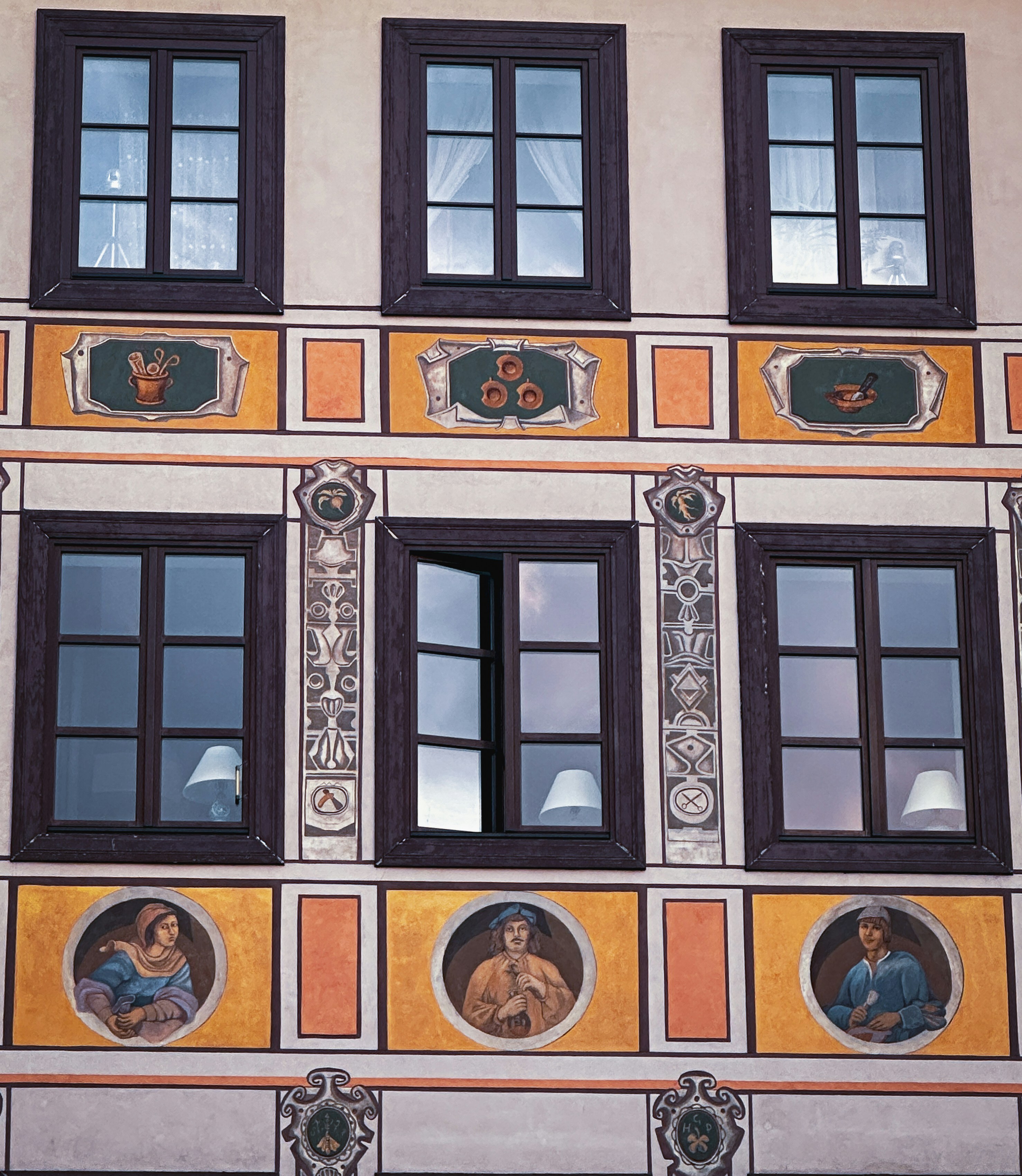 Medallion Windows on a Painted Facade: An Architectural Portrait