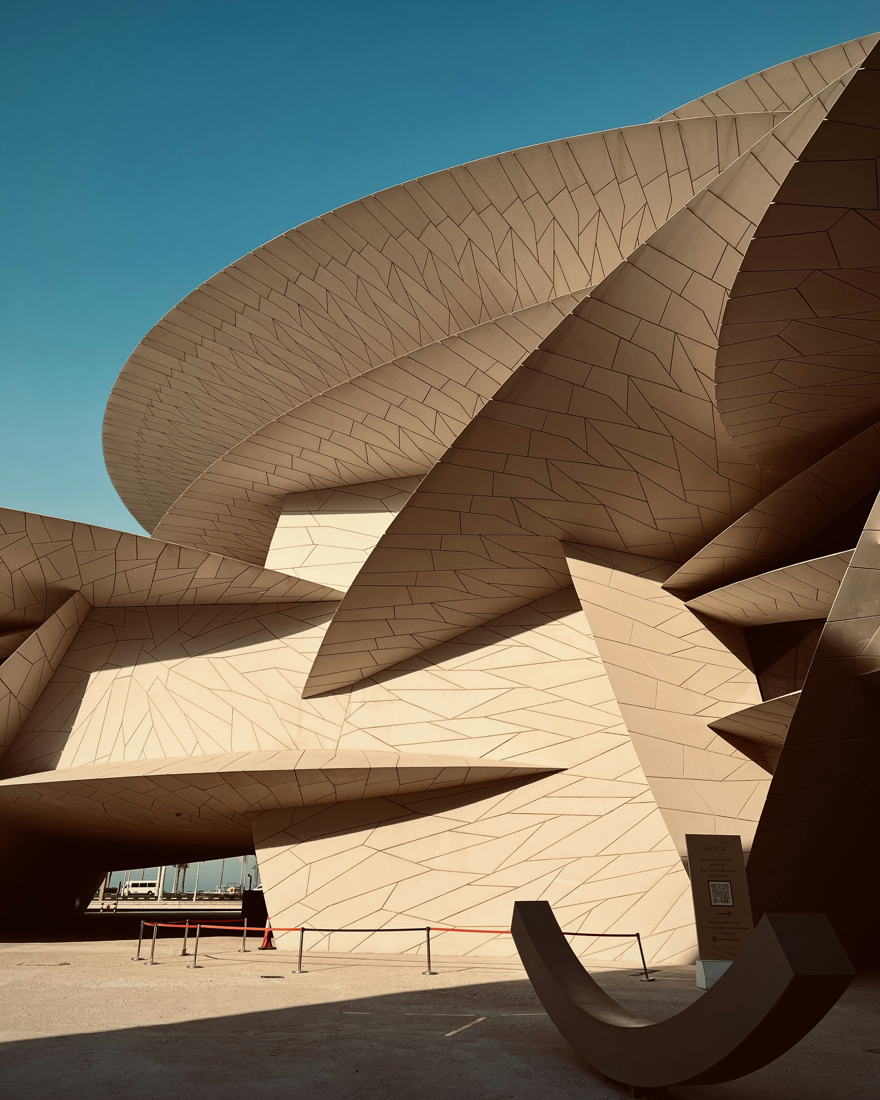 A large building that has a very large structure on top of it photo ...