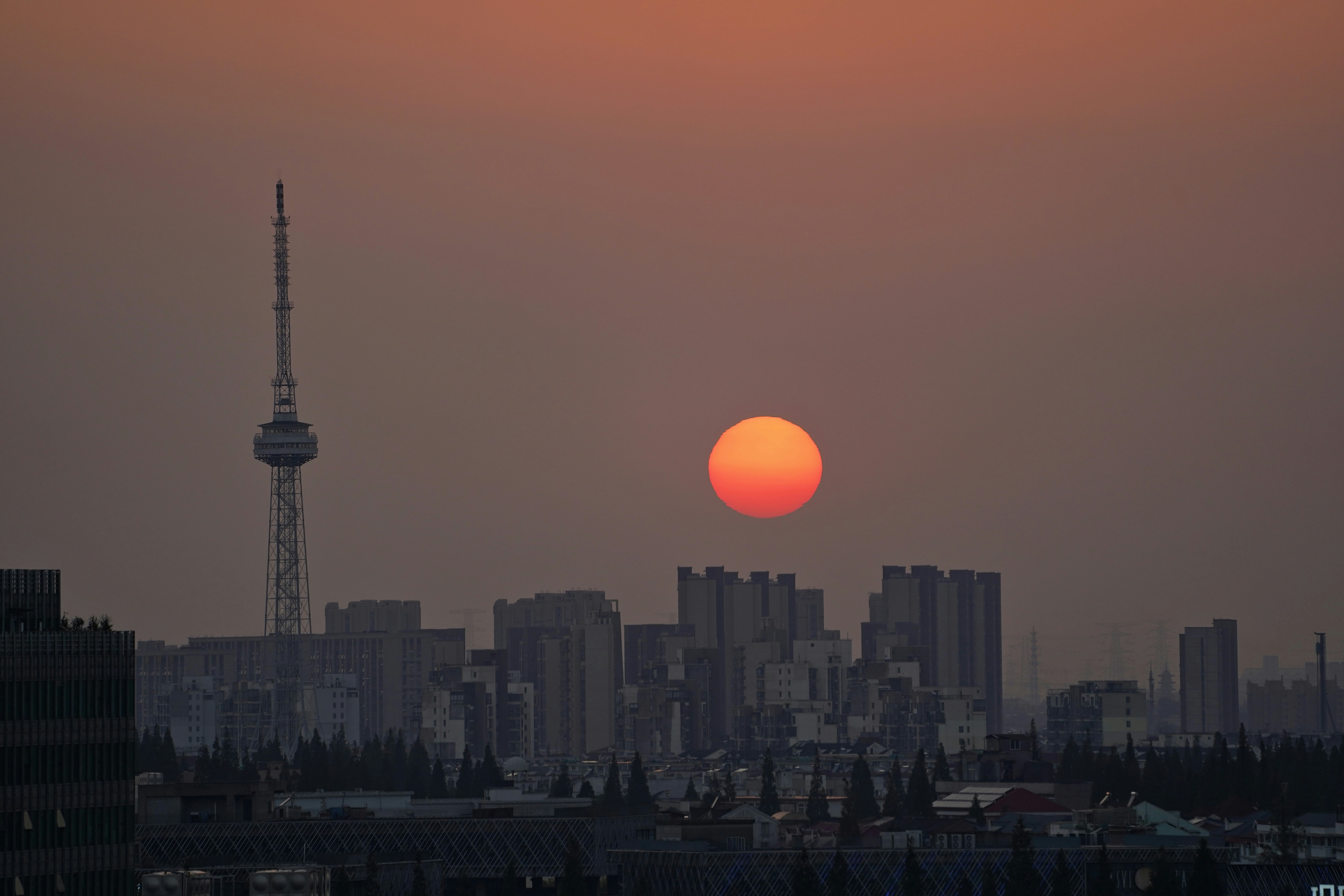 Crimson Sphere Over the City: Dusk Portrait of a Skyline