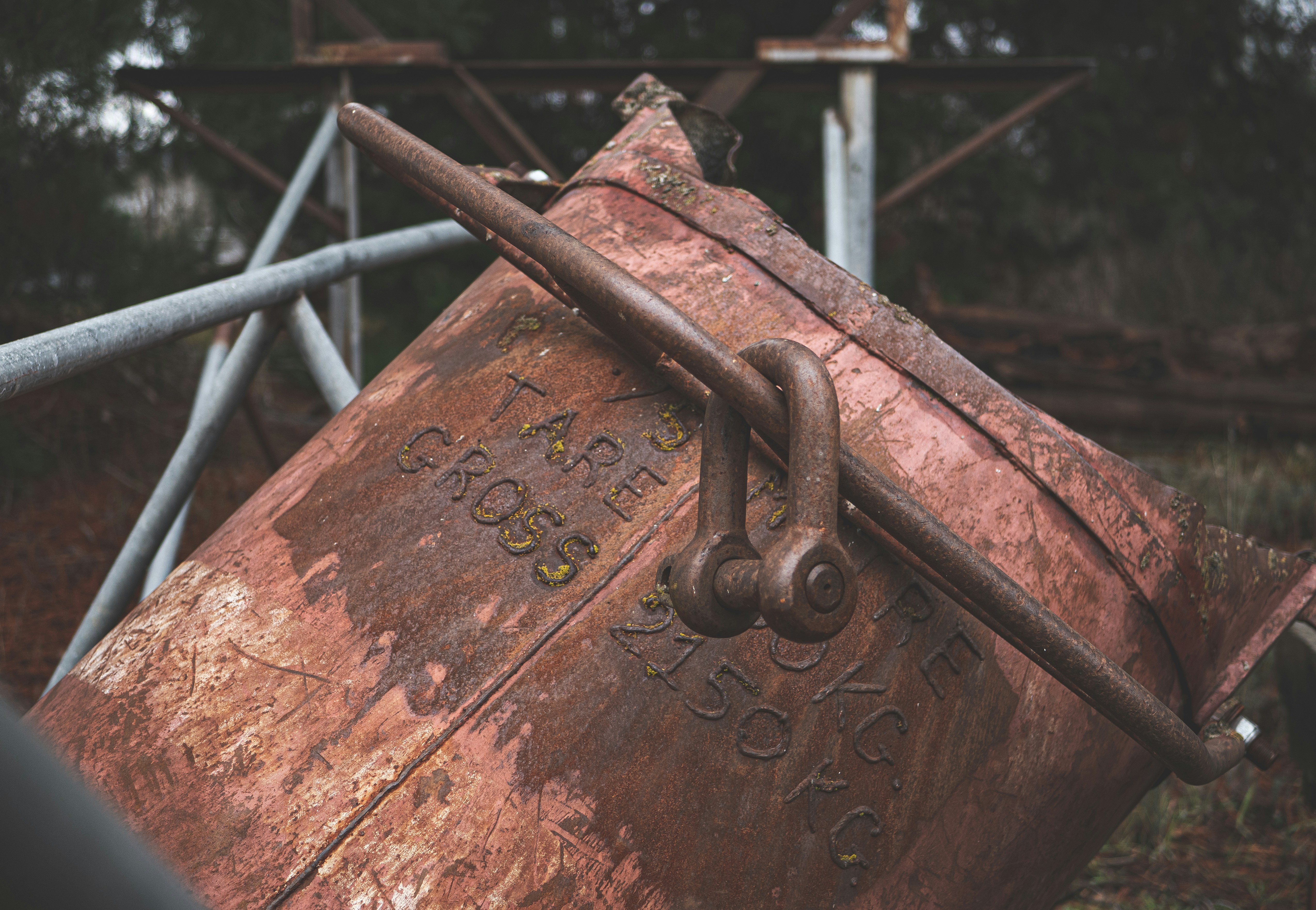 An old rusty suitcase sitting on top of a pile of junk photo – Free ...