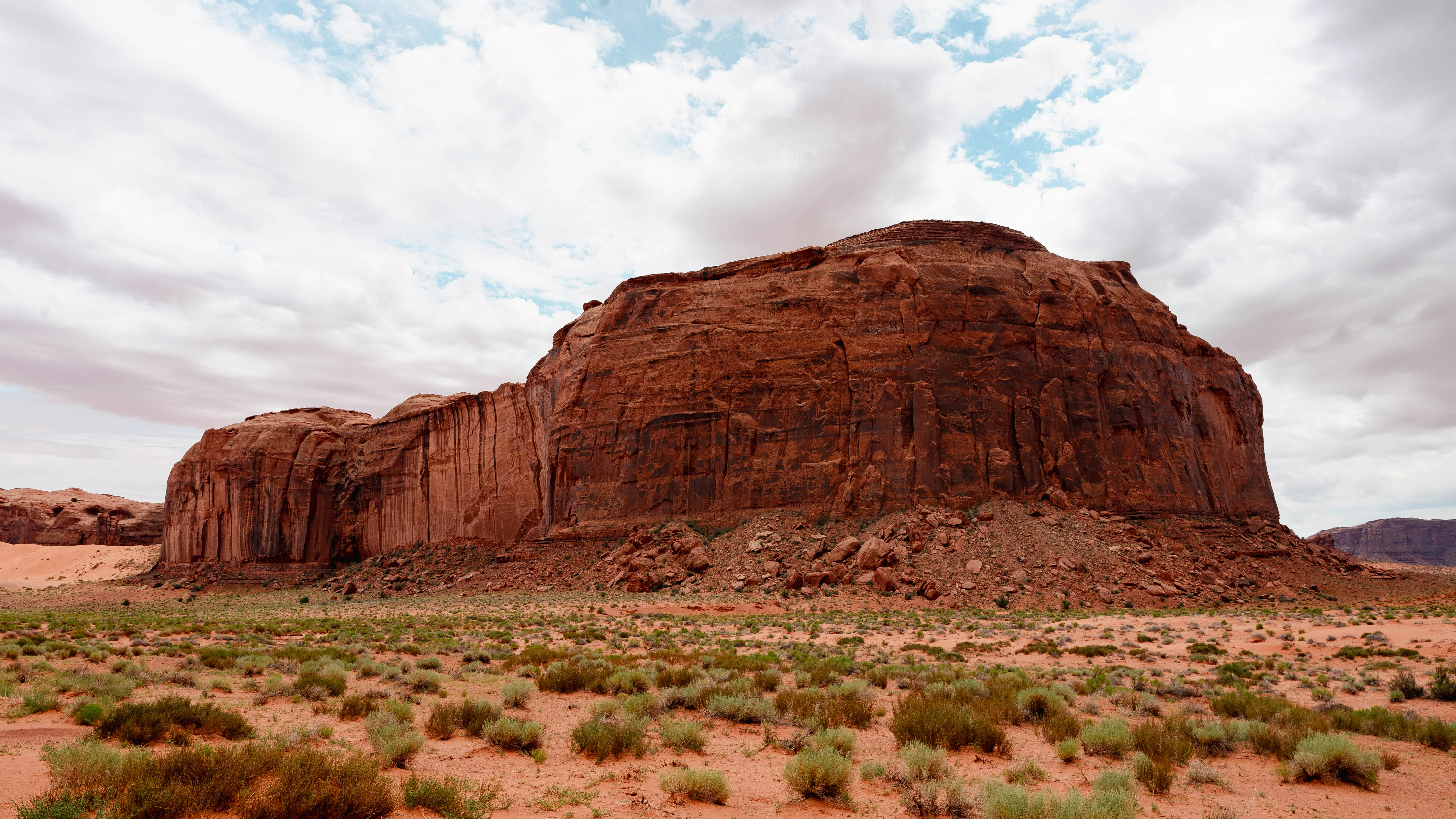 A large rock formation in the middle of a desert photo – Free Blue ...