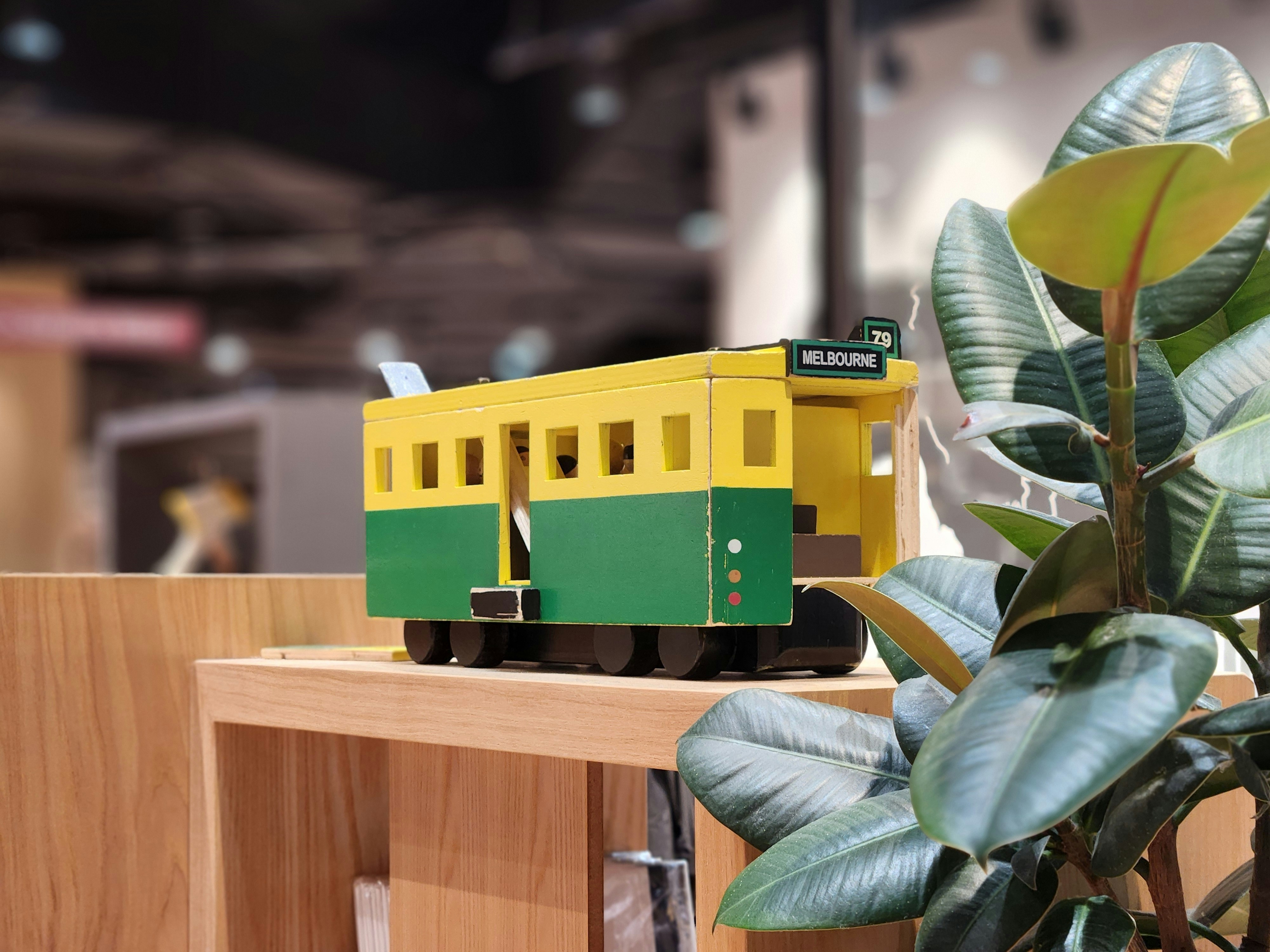 A green and yellow toy train on a track photo – Free Muji chadstone ...