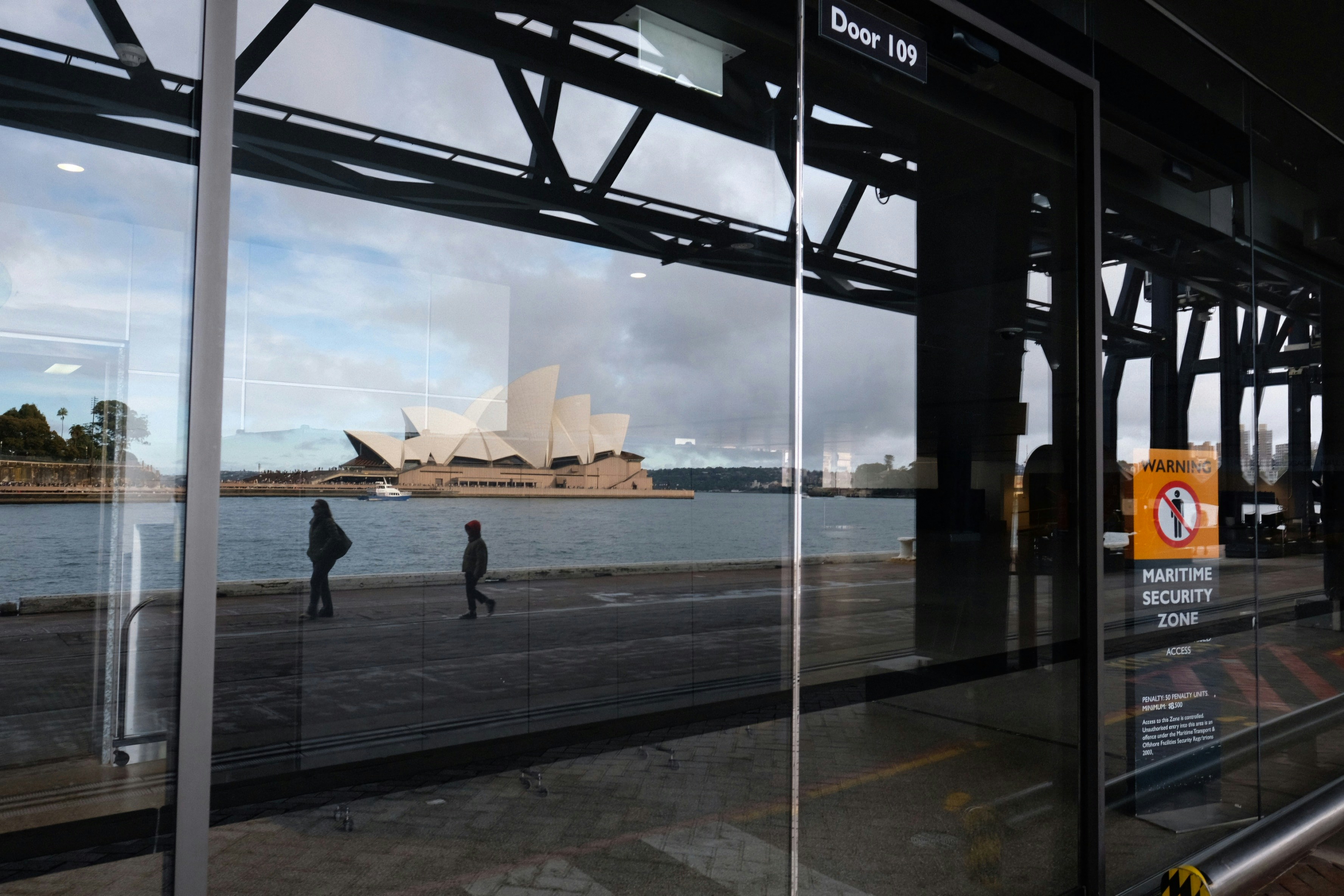 Reflections Beyond the Glass: Opera House Across Sydney Harbour