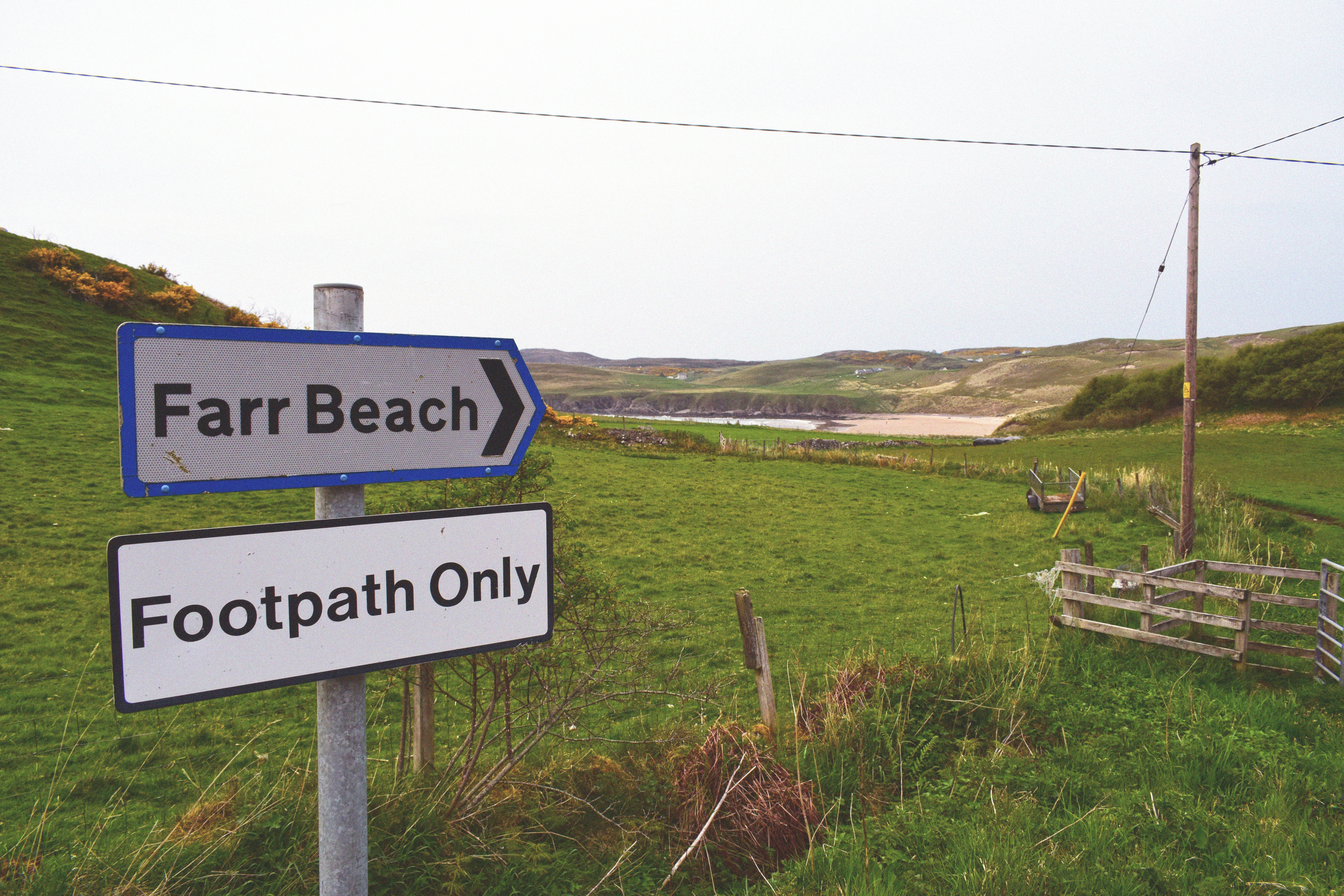 A couple of signs that are in the grass photo – Free Thurso Image on ...