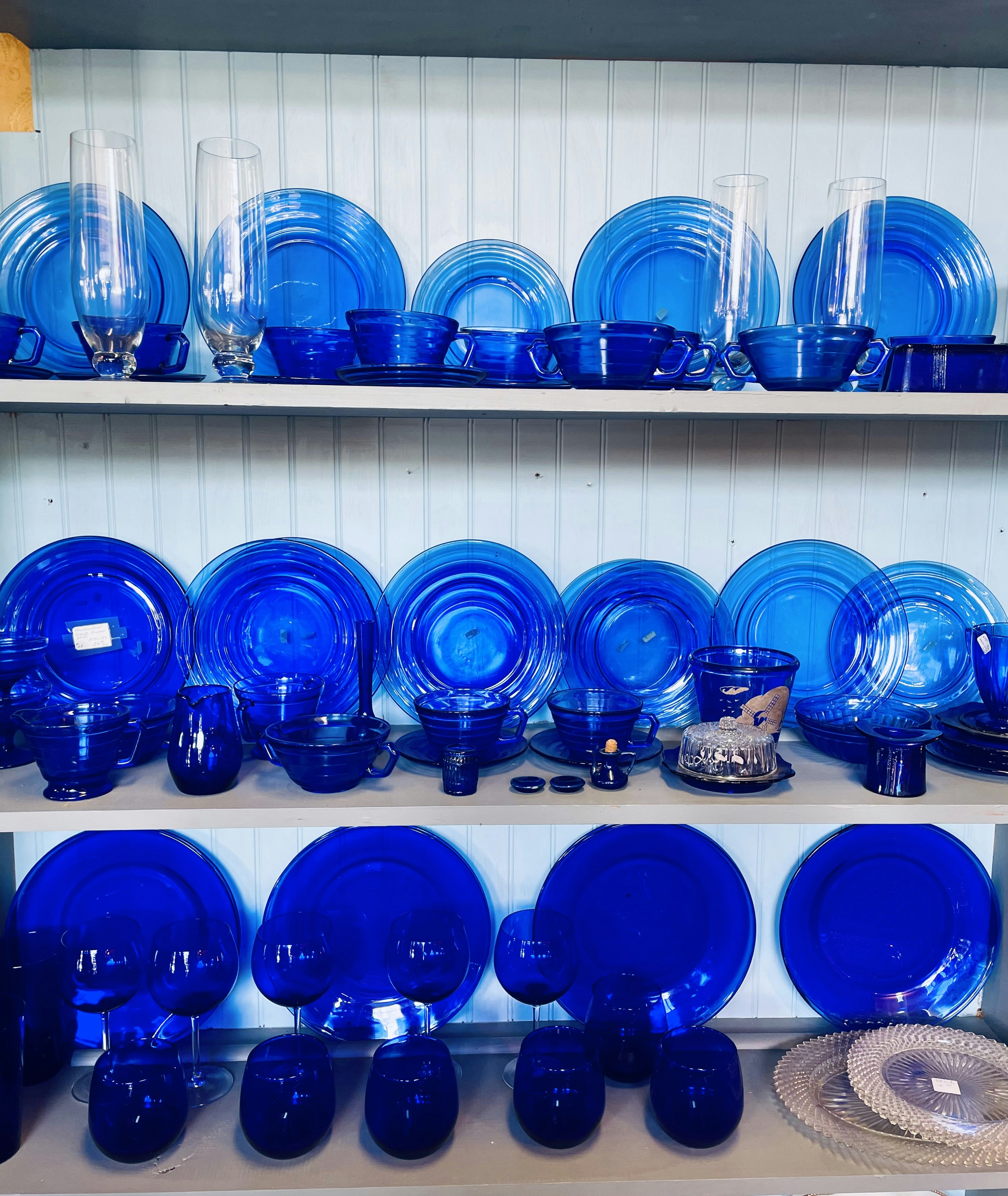 A shelf filled with blue plates and glasses photo – Free Blue pattern ...