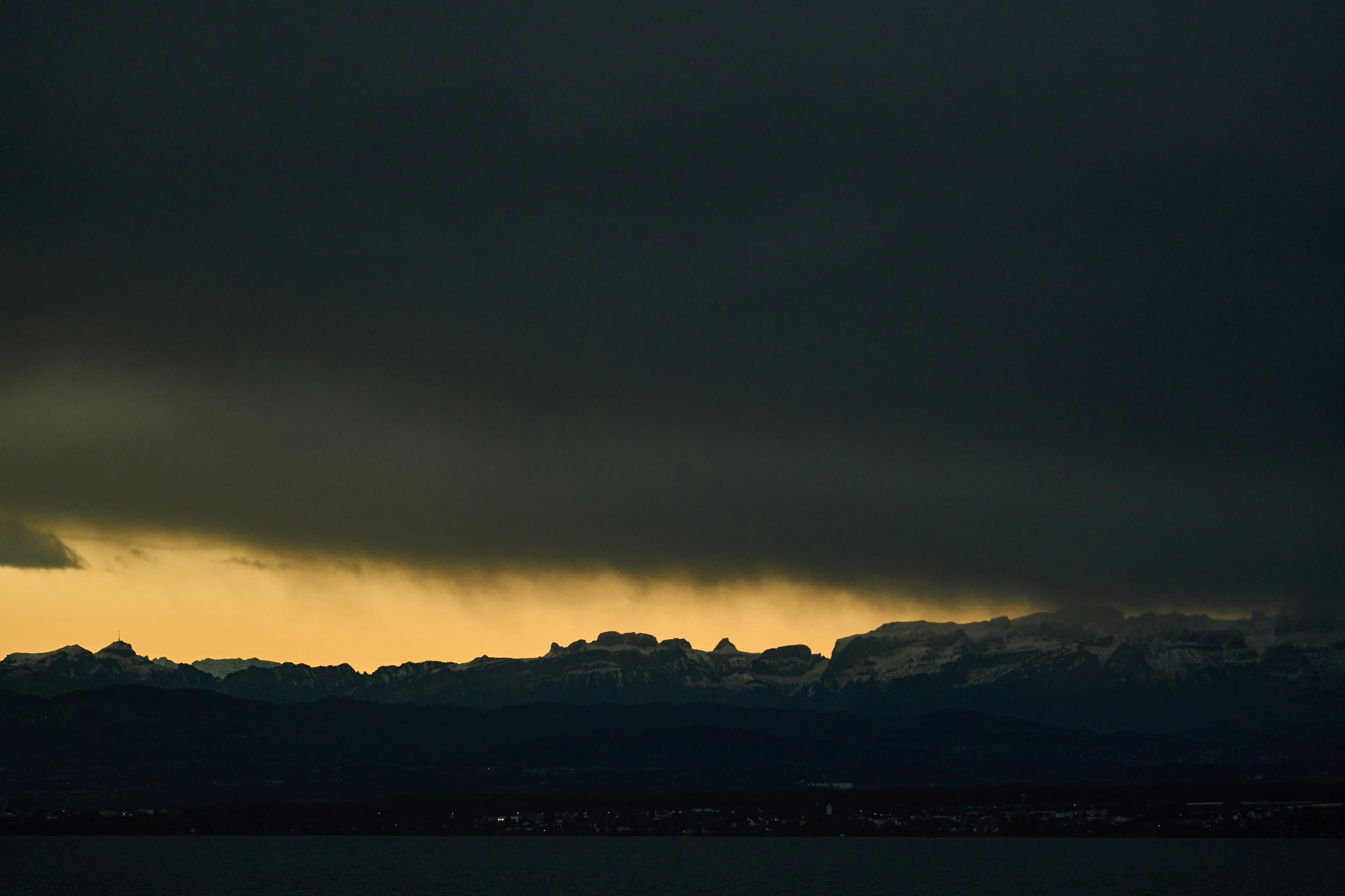A large body of water under a cloudy sky photo – Free Nature Image on ...