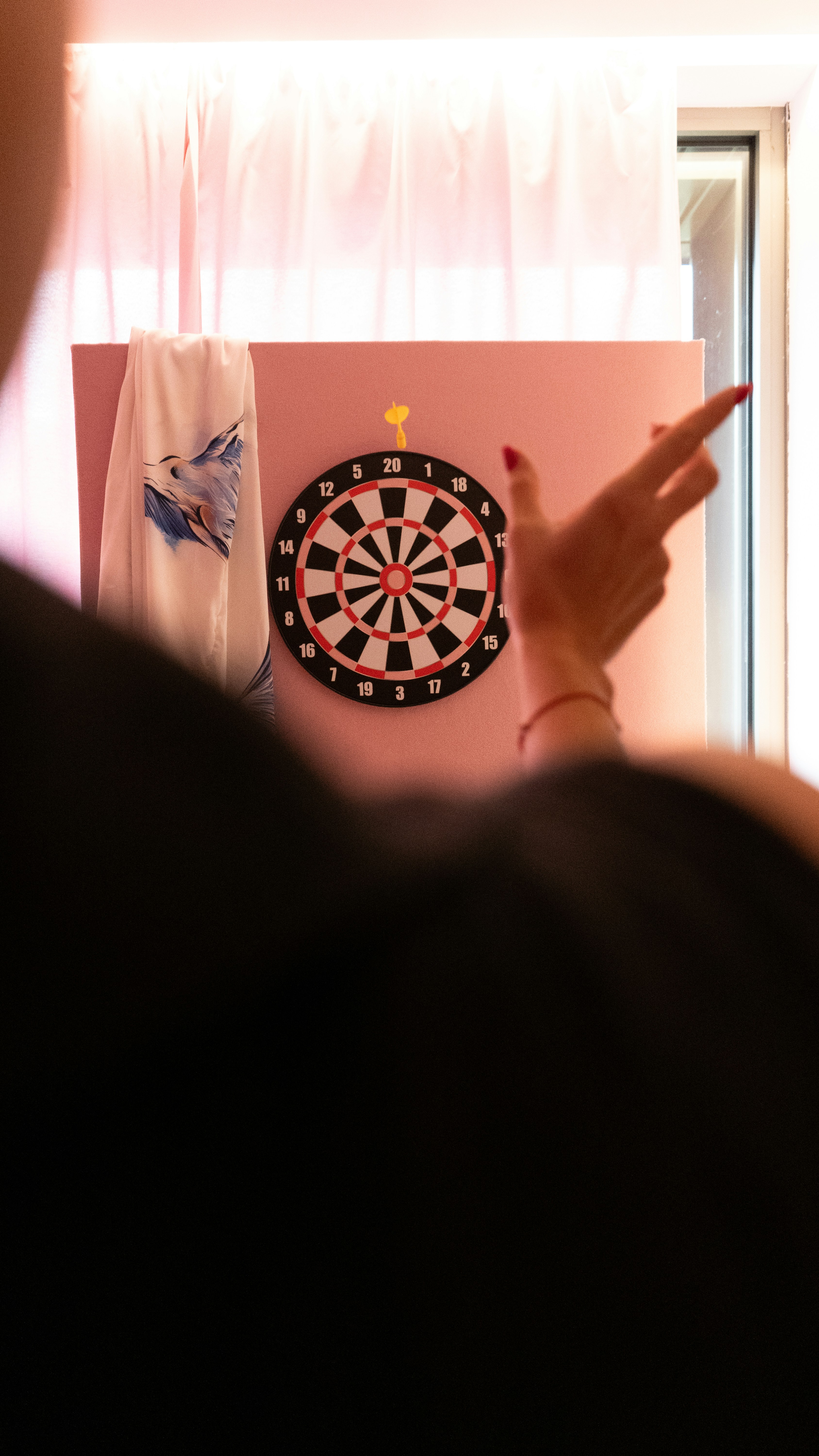 A person pointing at a dart on a wall photo – Free Karlovy vary Image ...