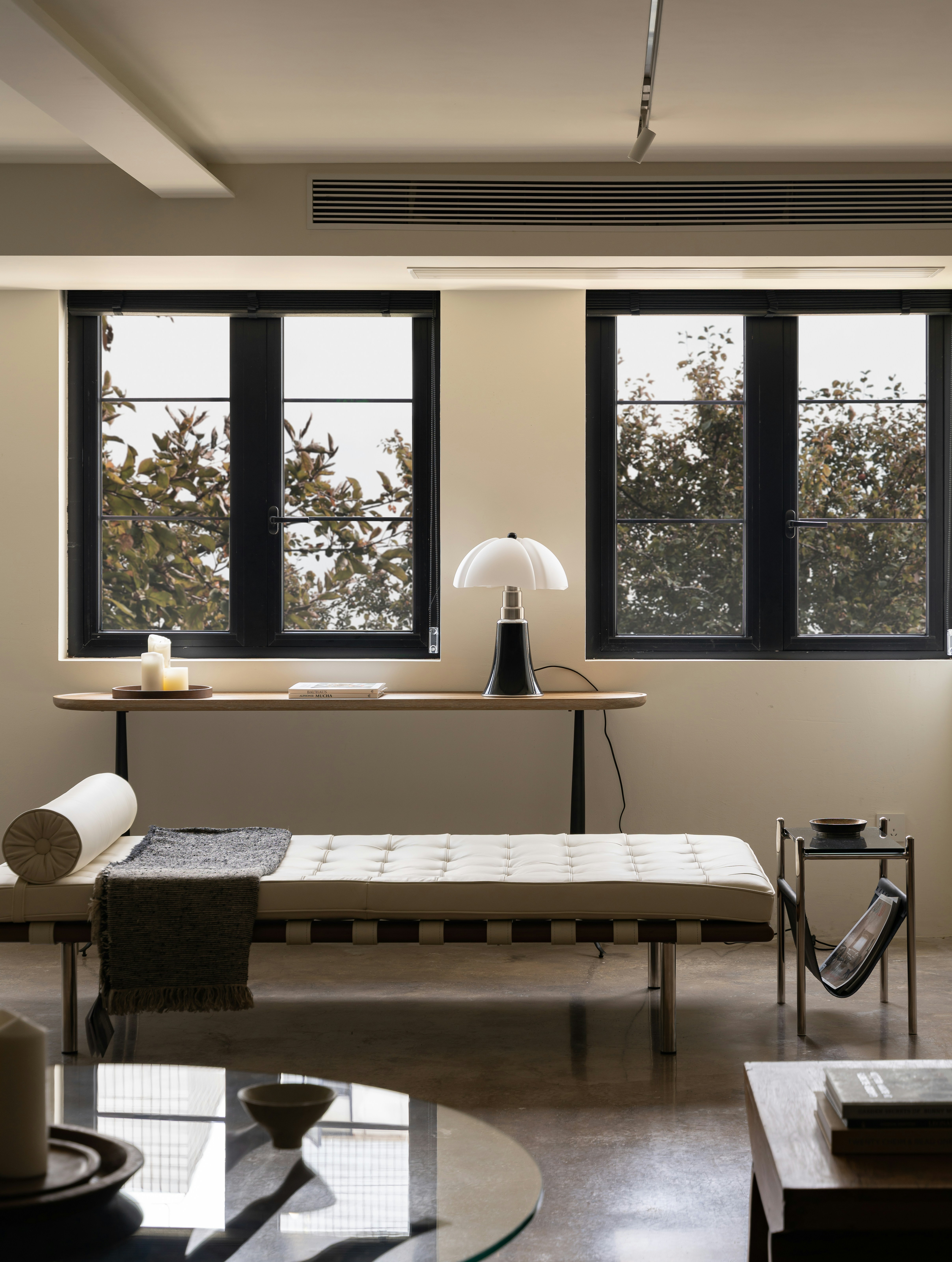 A living room filled with furniture and large windows photo – Free ...