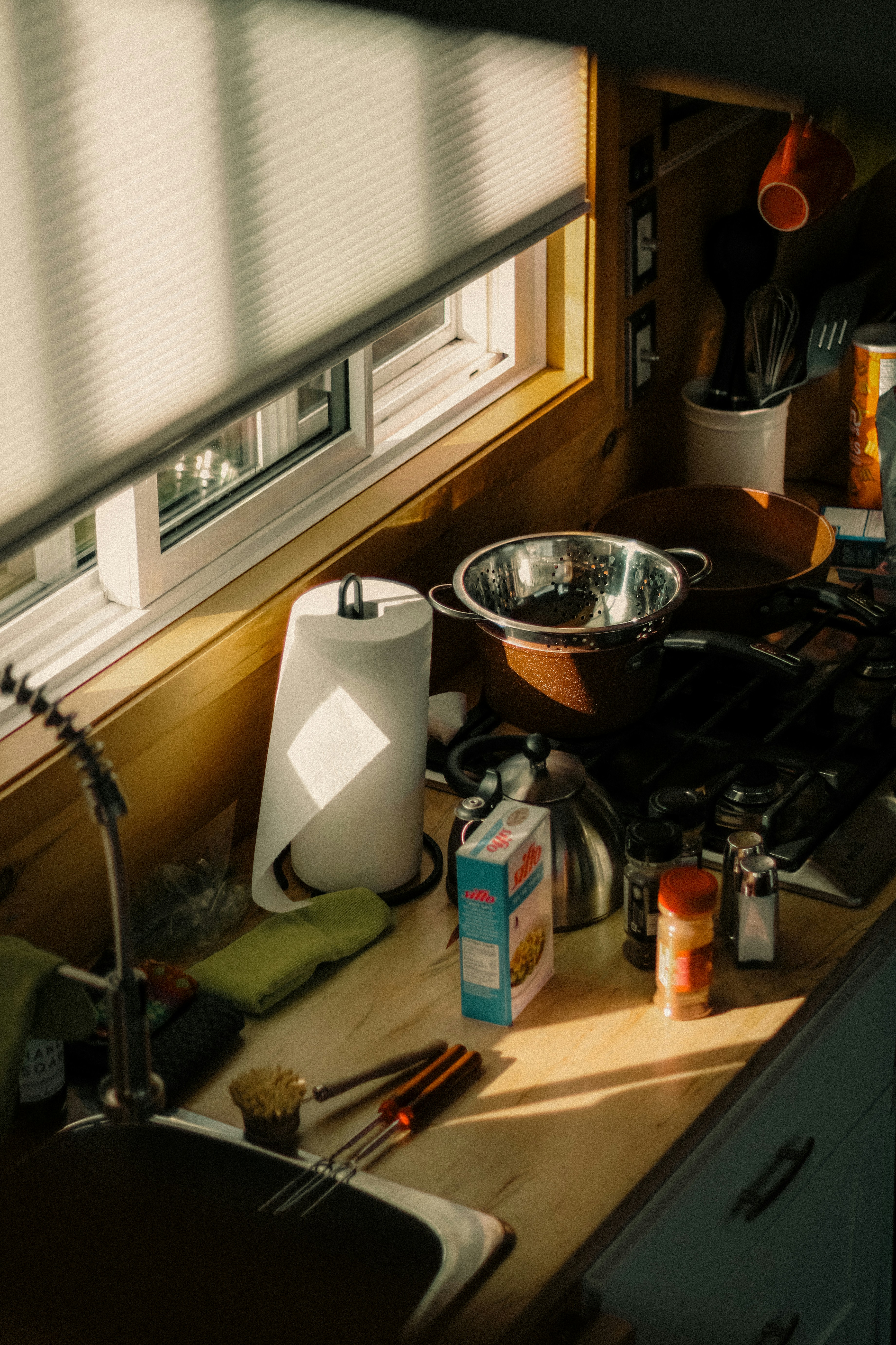 A kitchen counter with a sink and a window photo – Free Cooking pan ...