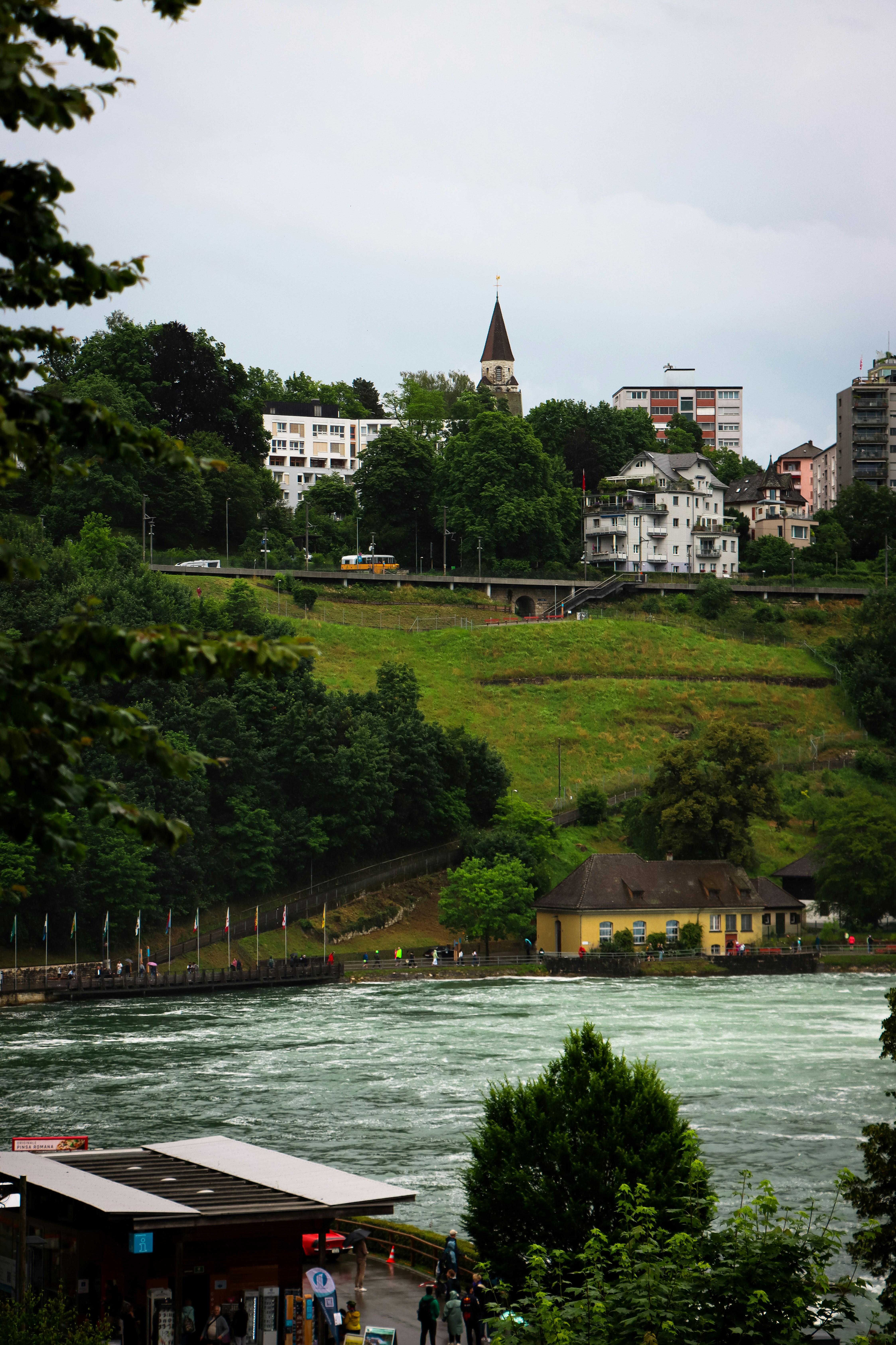 Steeple Above the River: Verdant Hillside Town