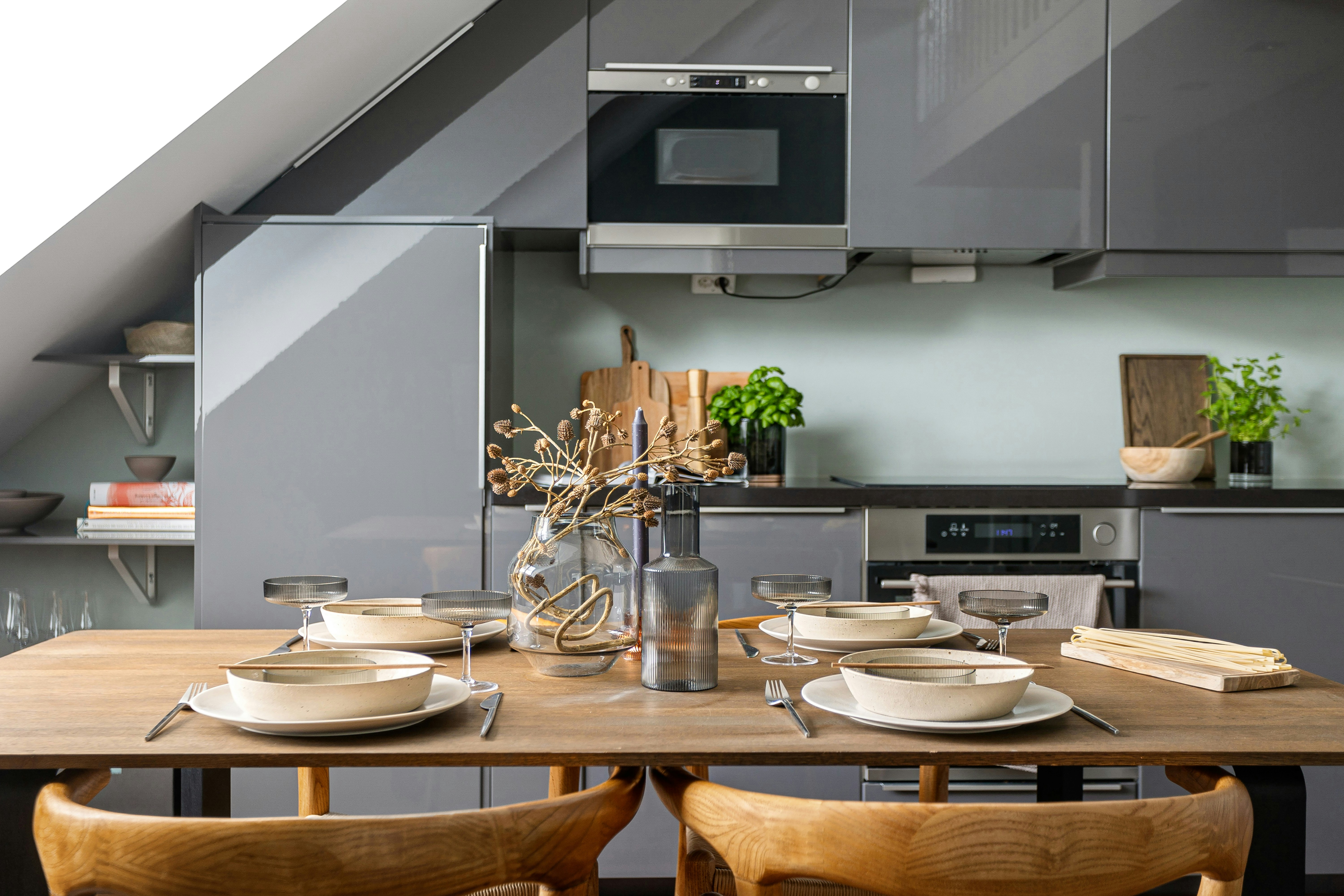 A kitchen with a table and chairs and a microwave photo – Free Kitchen ...