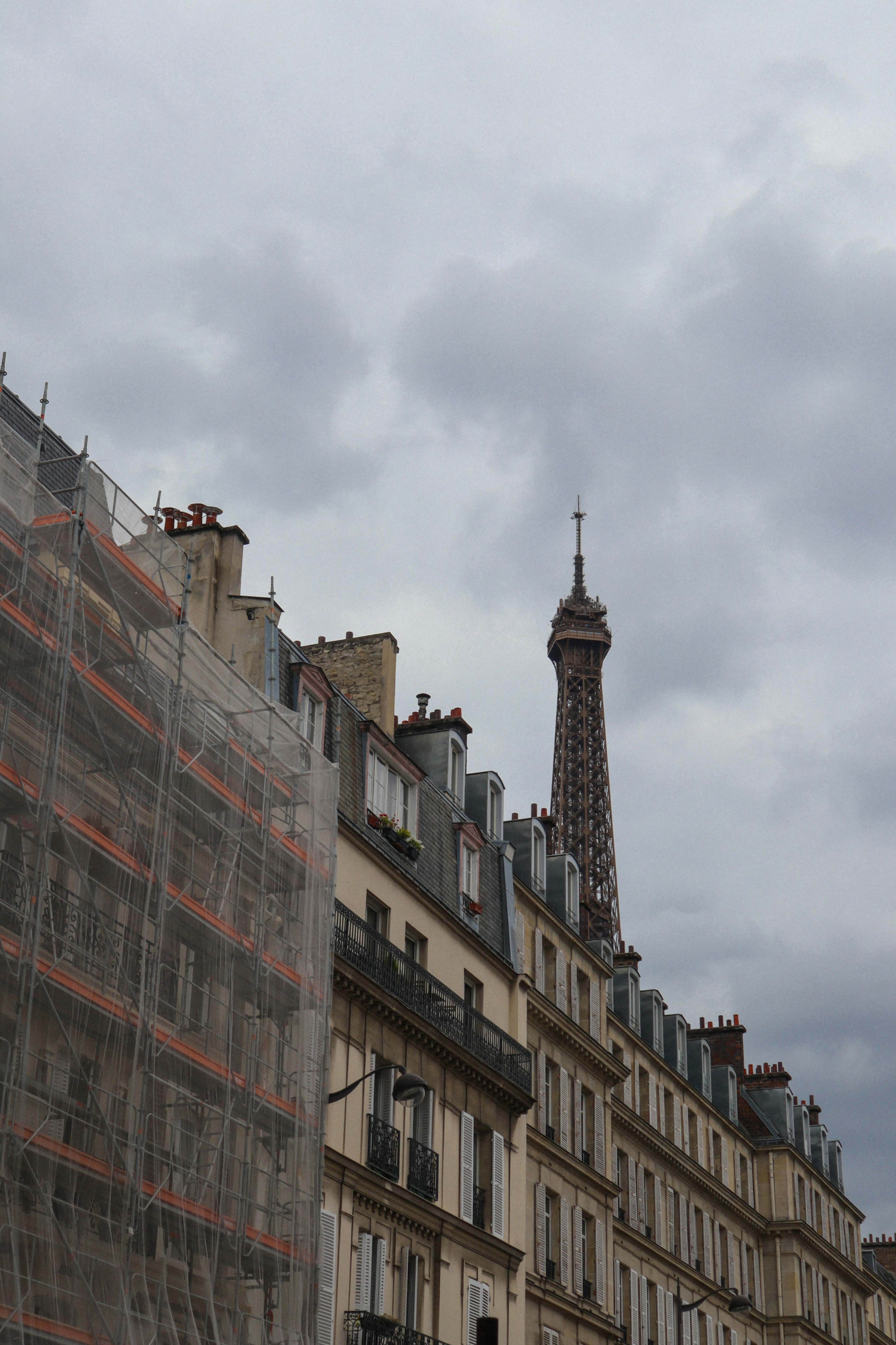 Iron Lace Above Paris: Haussmannian Rooftops Framing the Eiffel Tower