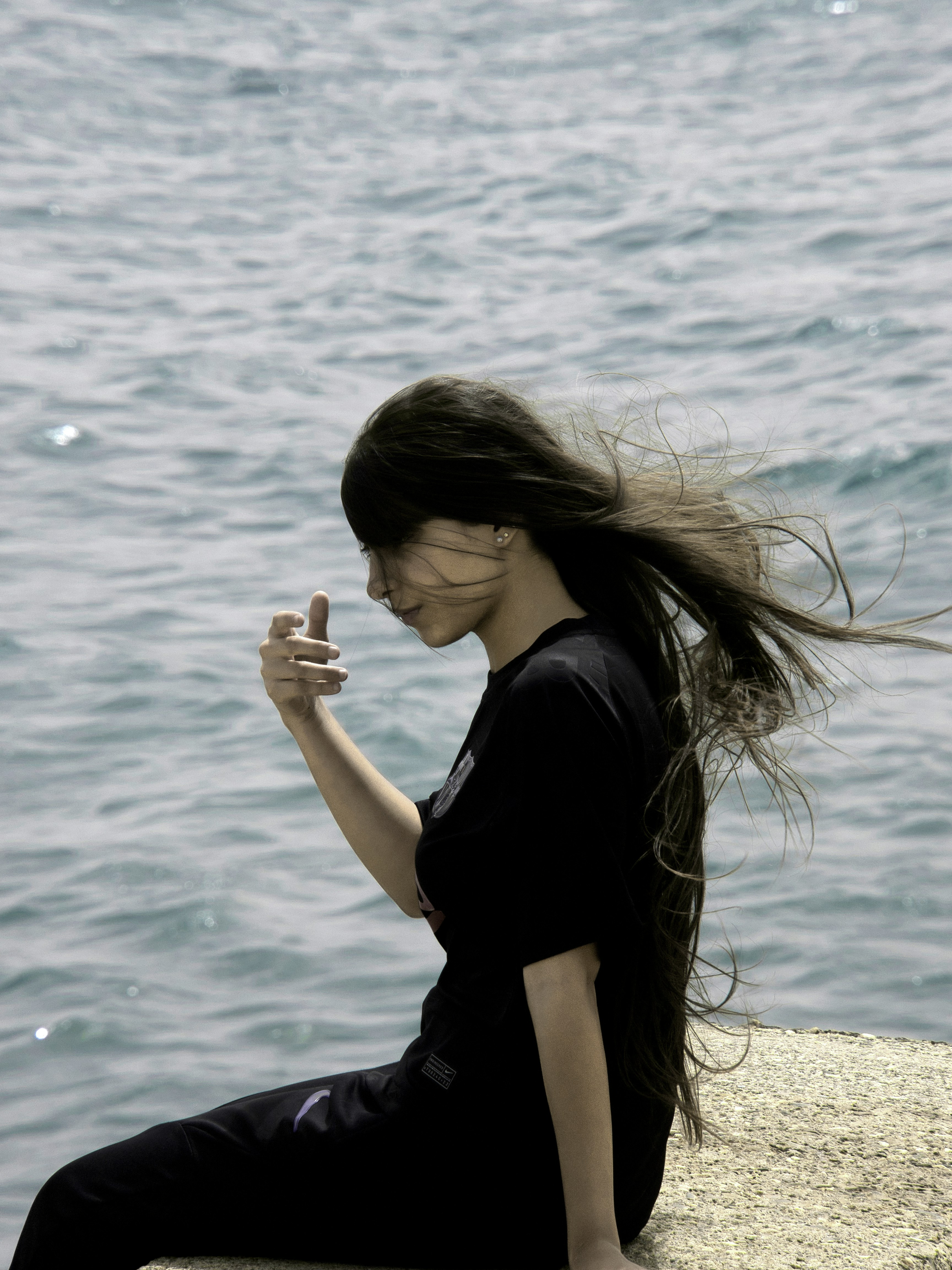 Windward Solitude: A Seaside Portrait on the Breakwater