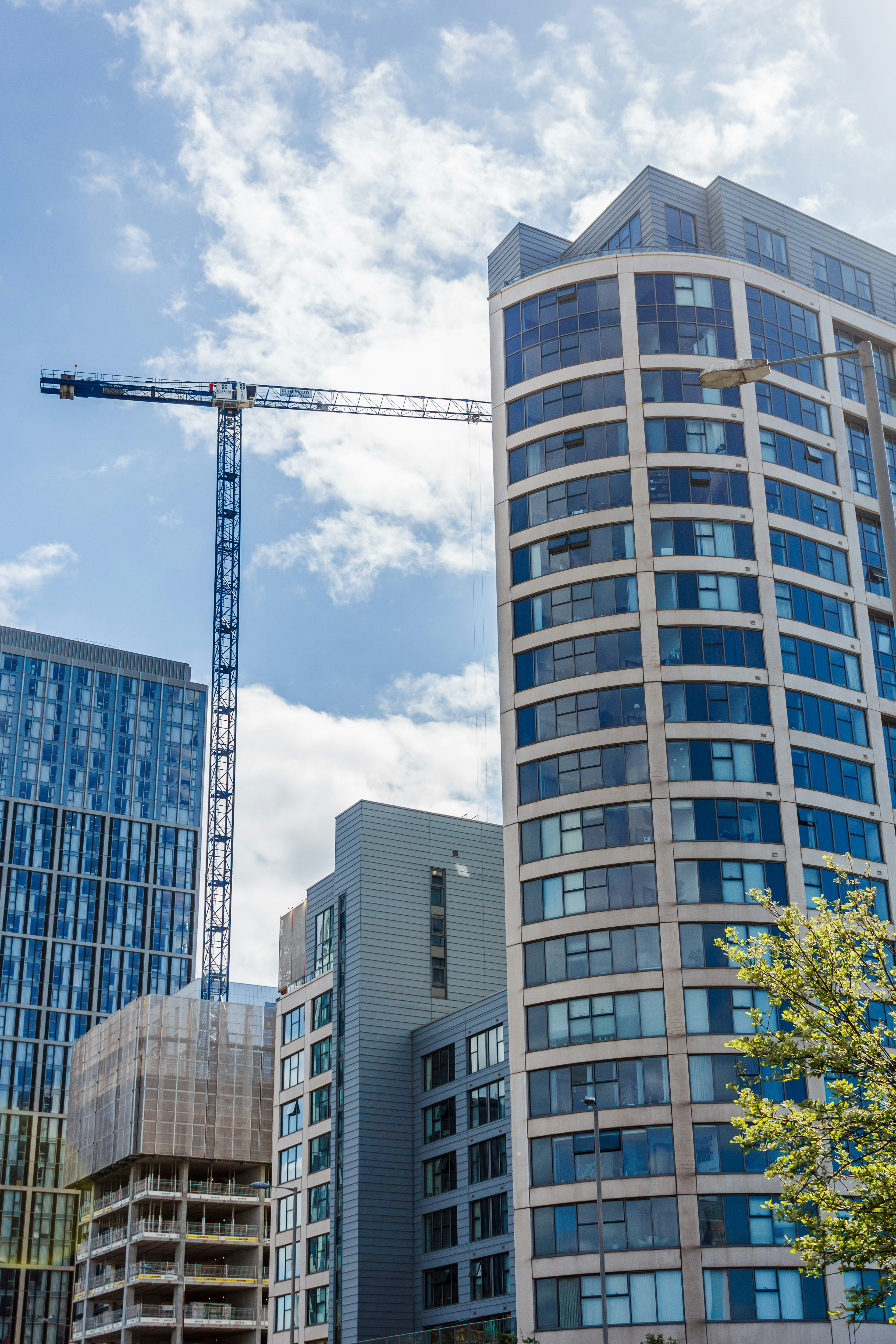 Construction work at Princes Dock, Liverpool. | A crane is standing in front of a building under construction