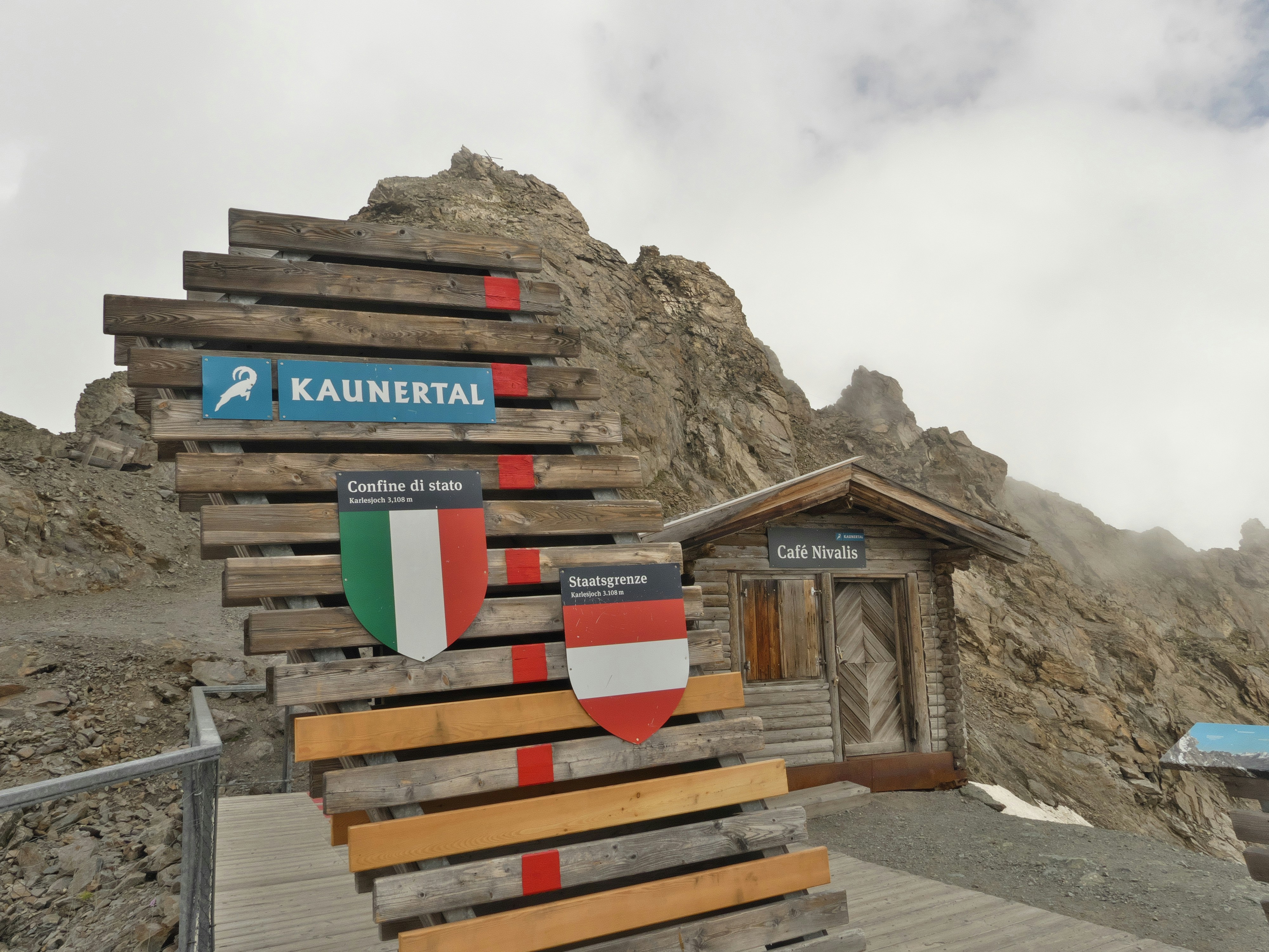 Alpine Waymarker: Signposts Guard the Narrow Ridge