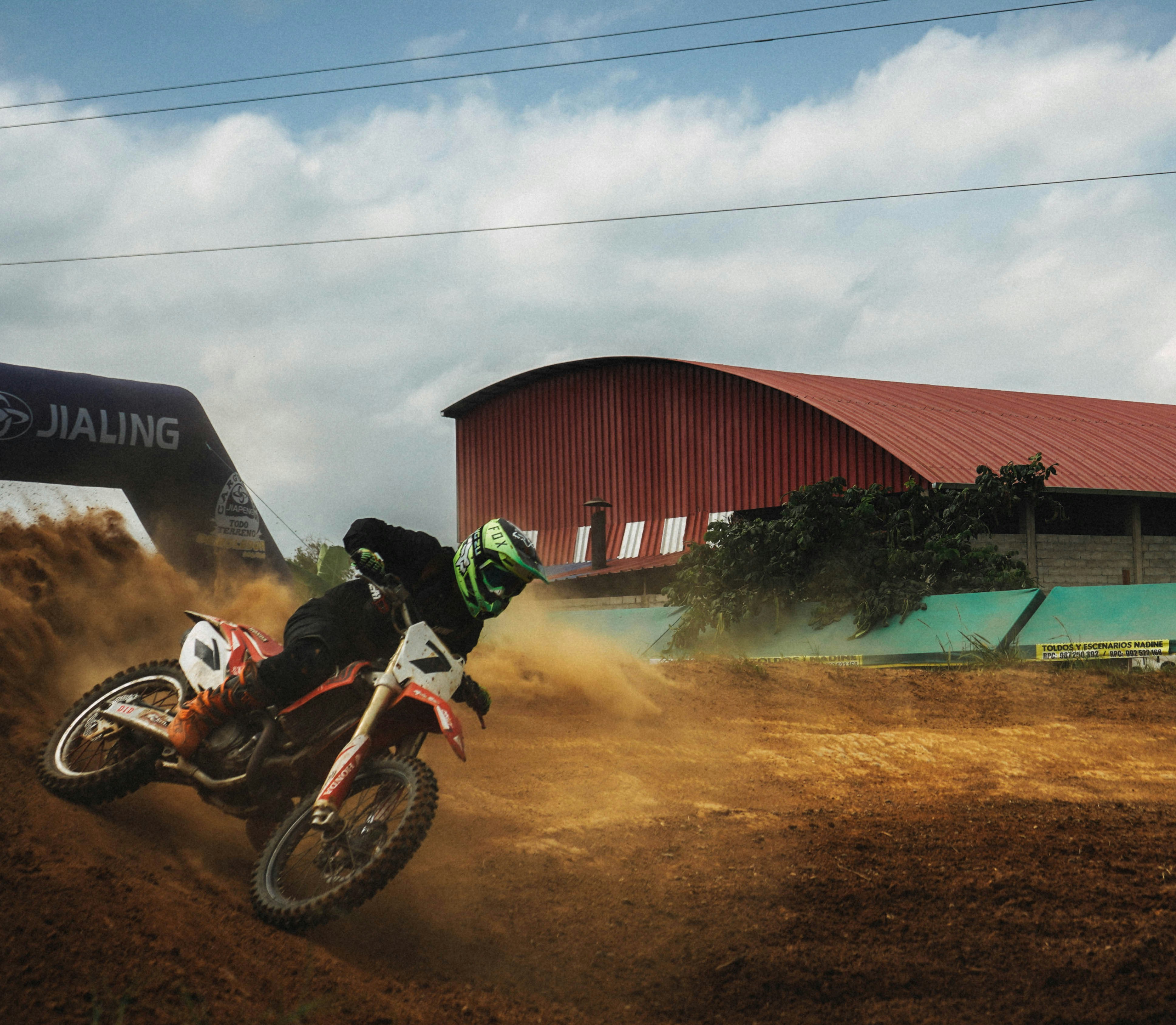 Rider in a Dusty Bend: A Moto Cross Moment