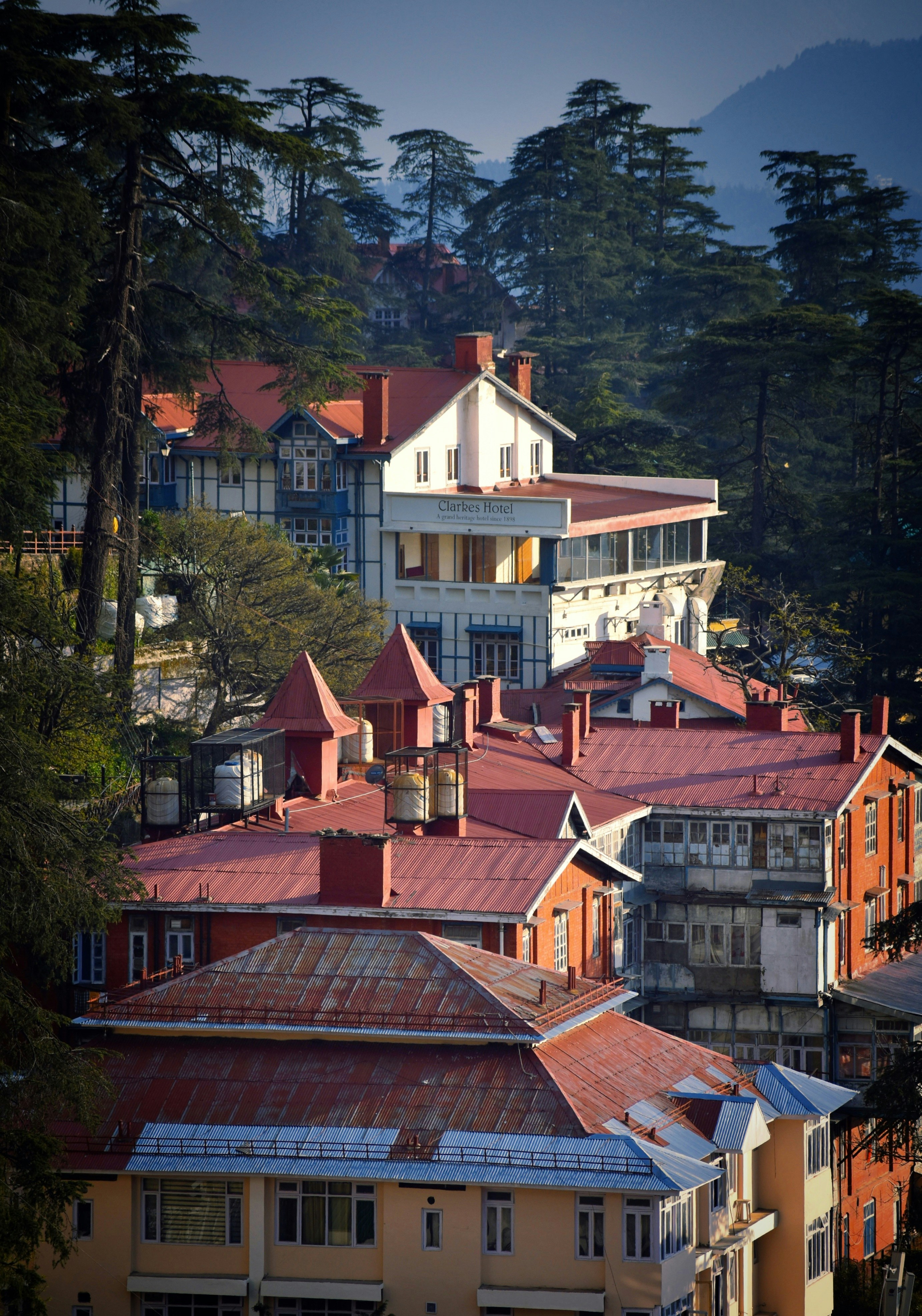 A view of a city with lots of tall buildings photo – Free Shimla Image ...