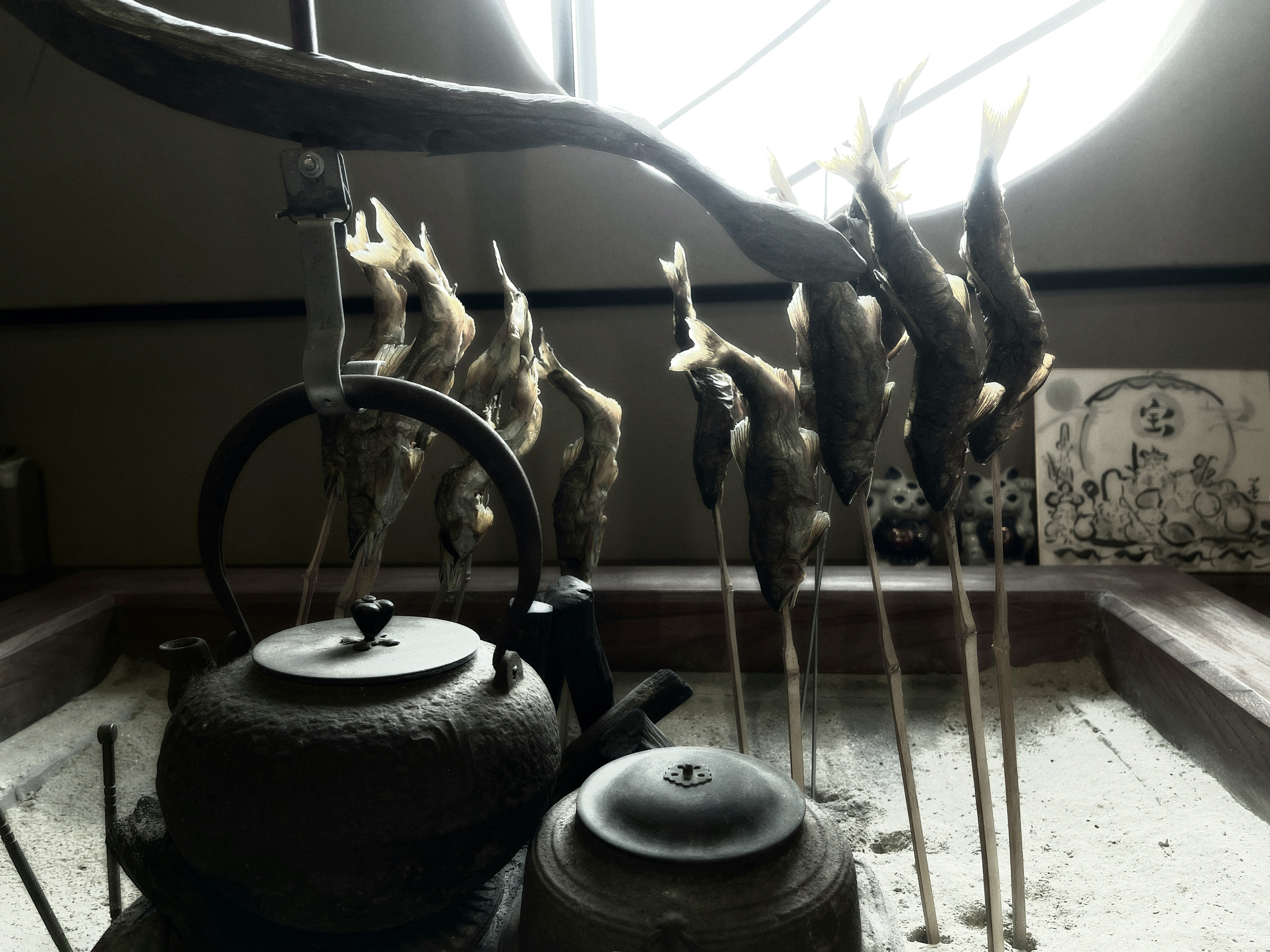 Dim Sunlight Illuminates a Rustic Kitchen Still Life: Kettle, Skewers, and Steam