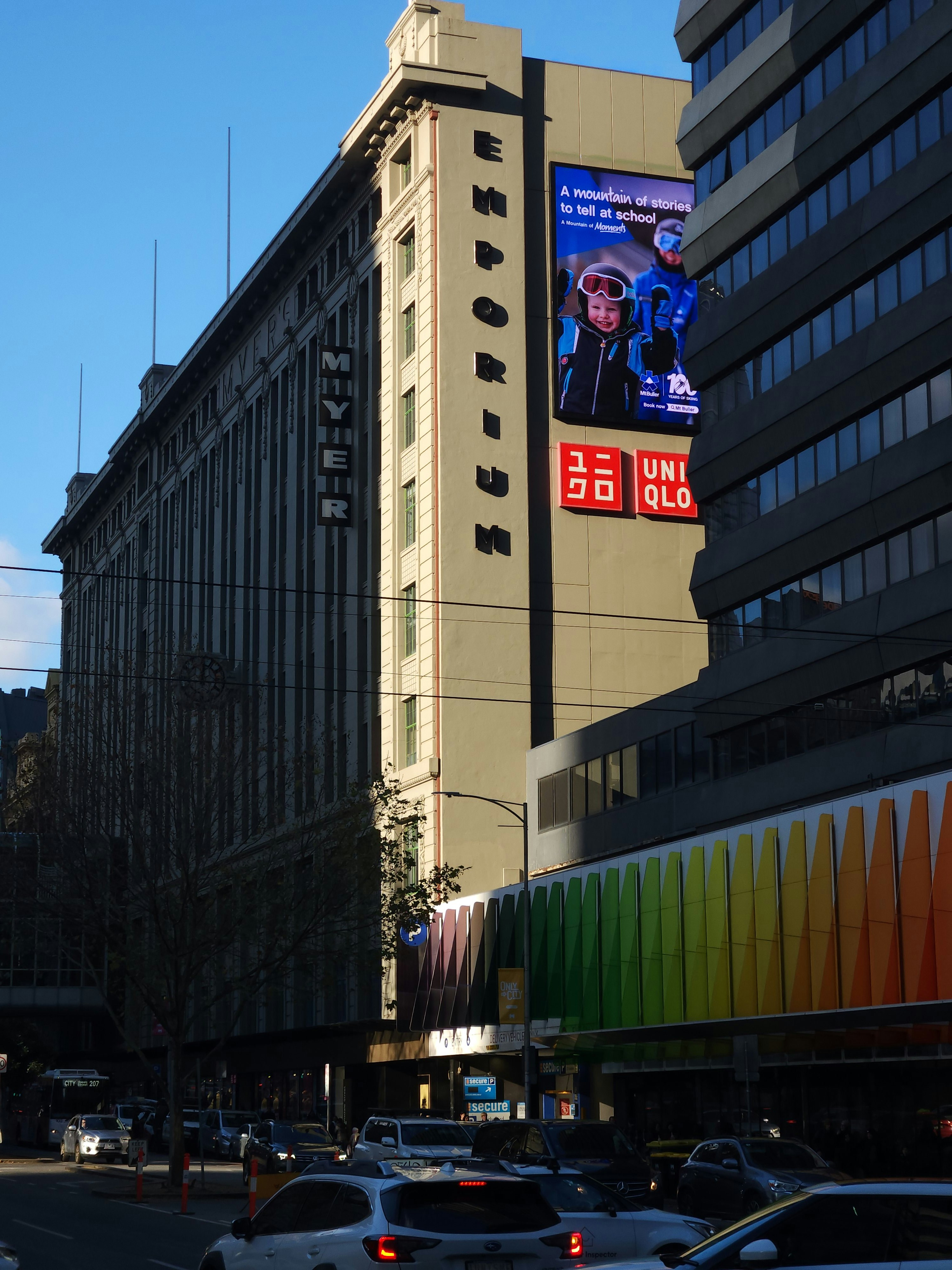Signscape at Noon: Emporium Tower Over Rainbow Street