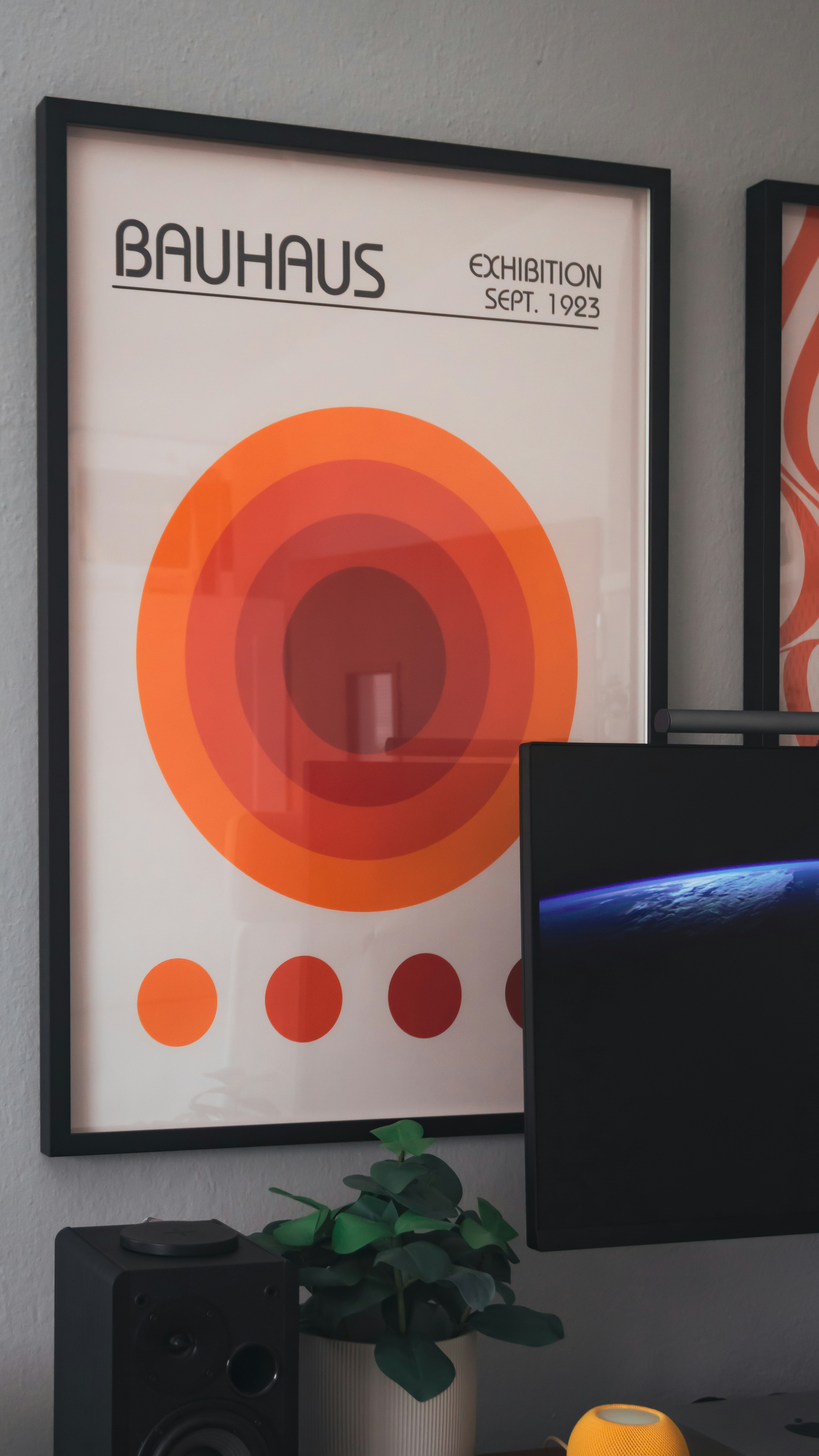 Orange Rings and Framed Art: A Corner of Modern Retro