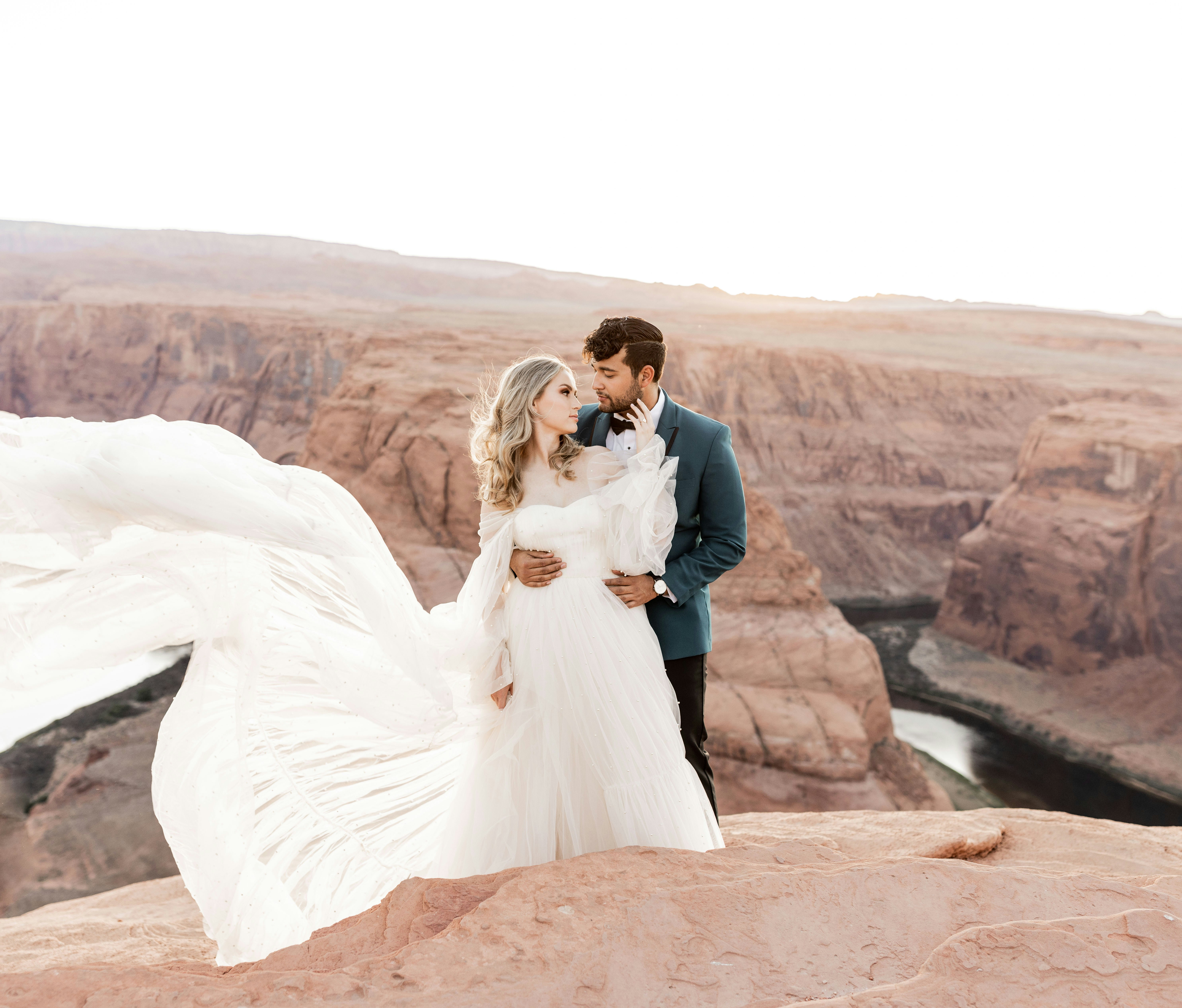 Bridal Embrace on the Edge: Love Amid Red Canyon Overlook