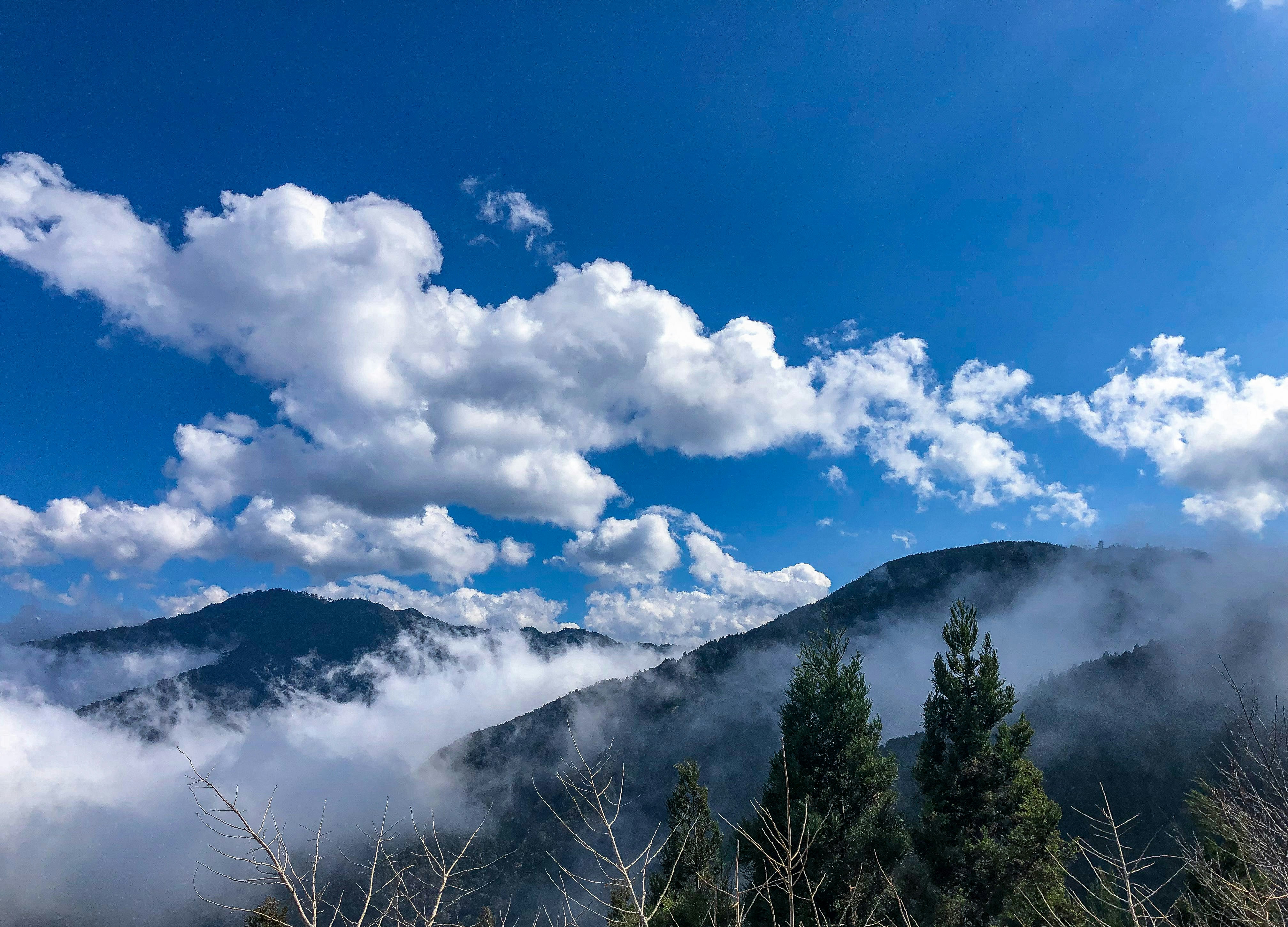 Whispering Clouds Over Mountain Peaks