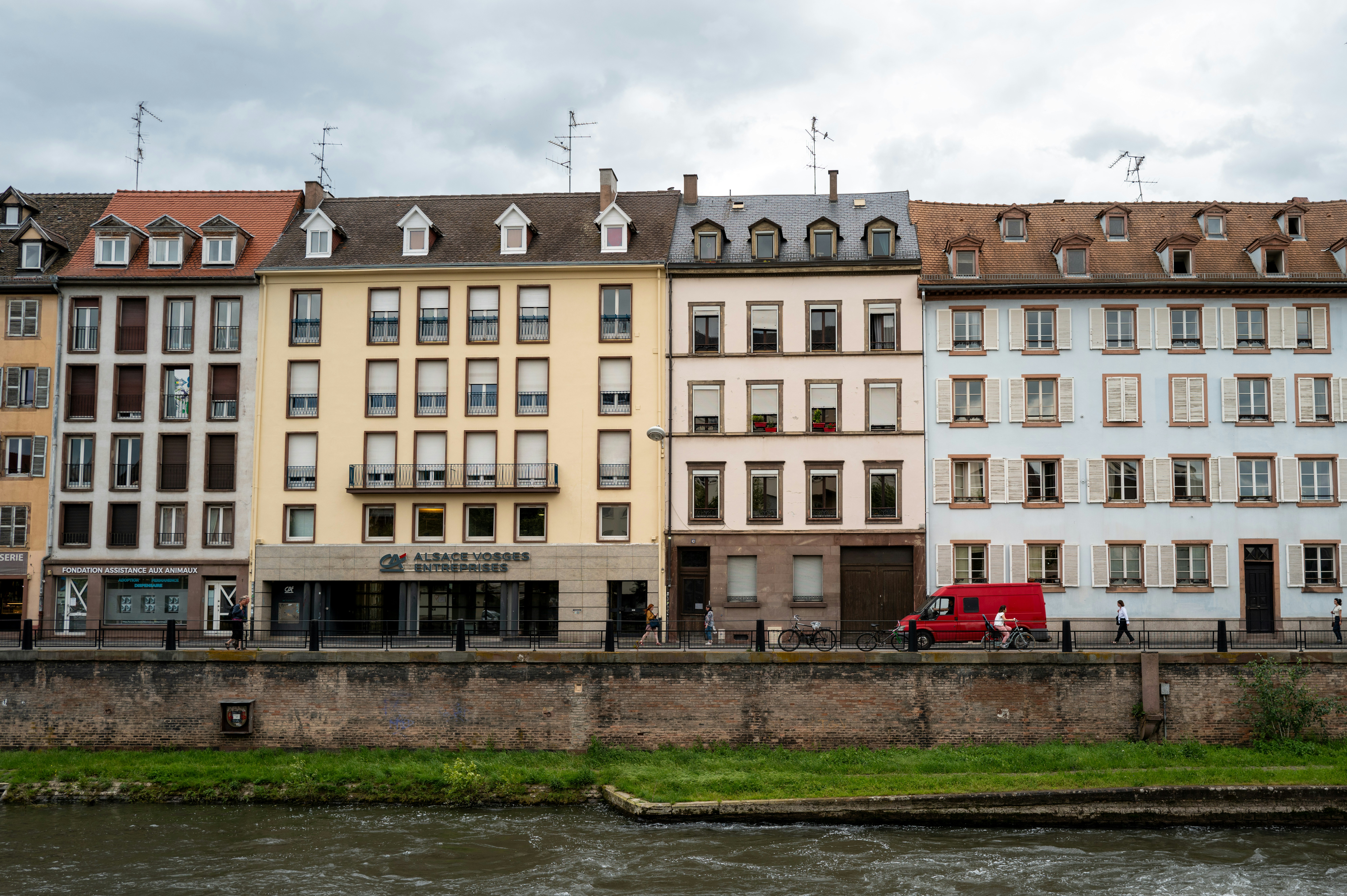 Pastel Facades Over the River: A Timeless European Riverside Row