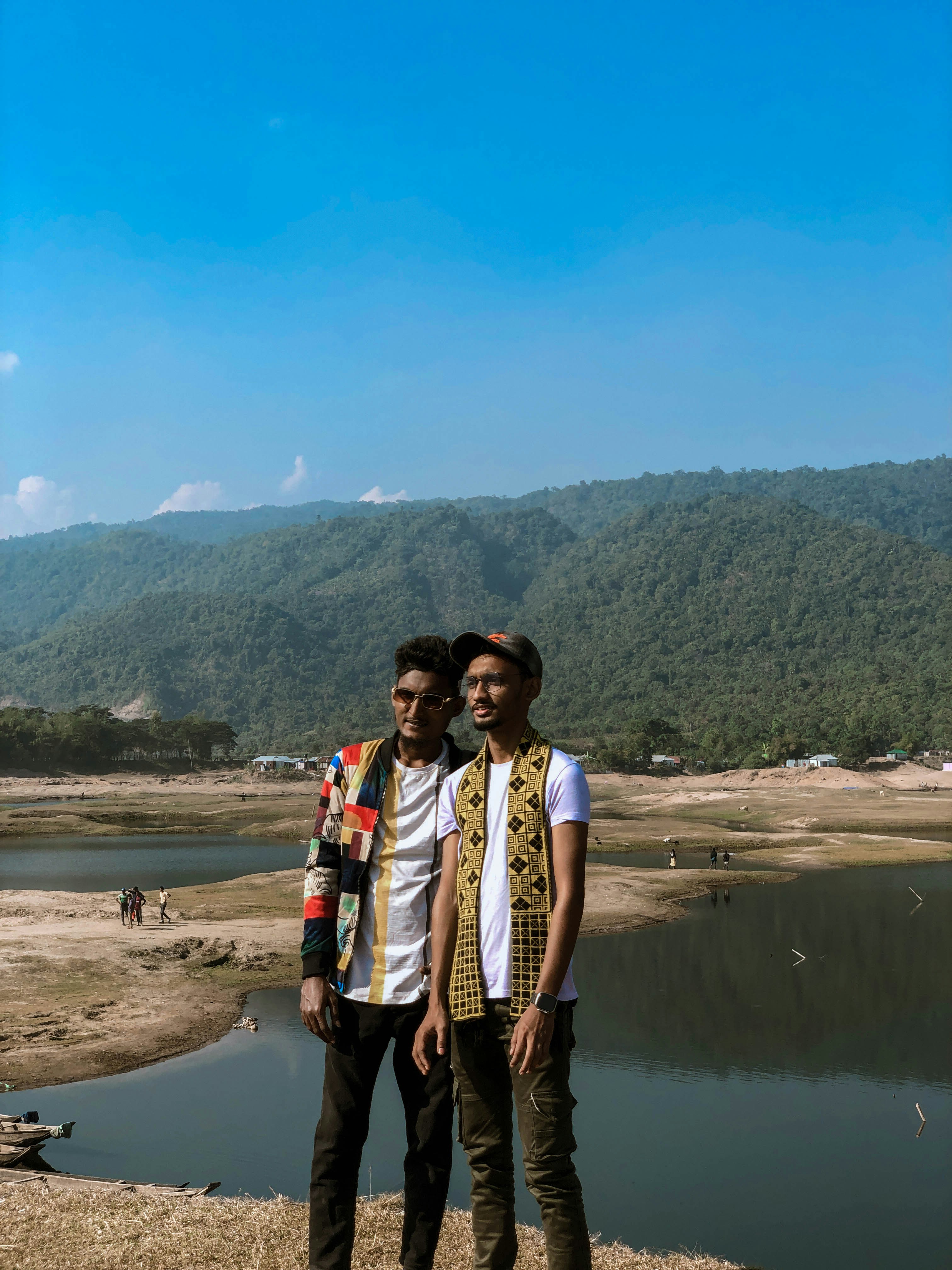 Two Friends at the Riverside Gate to a Mountain Horizon