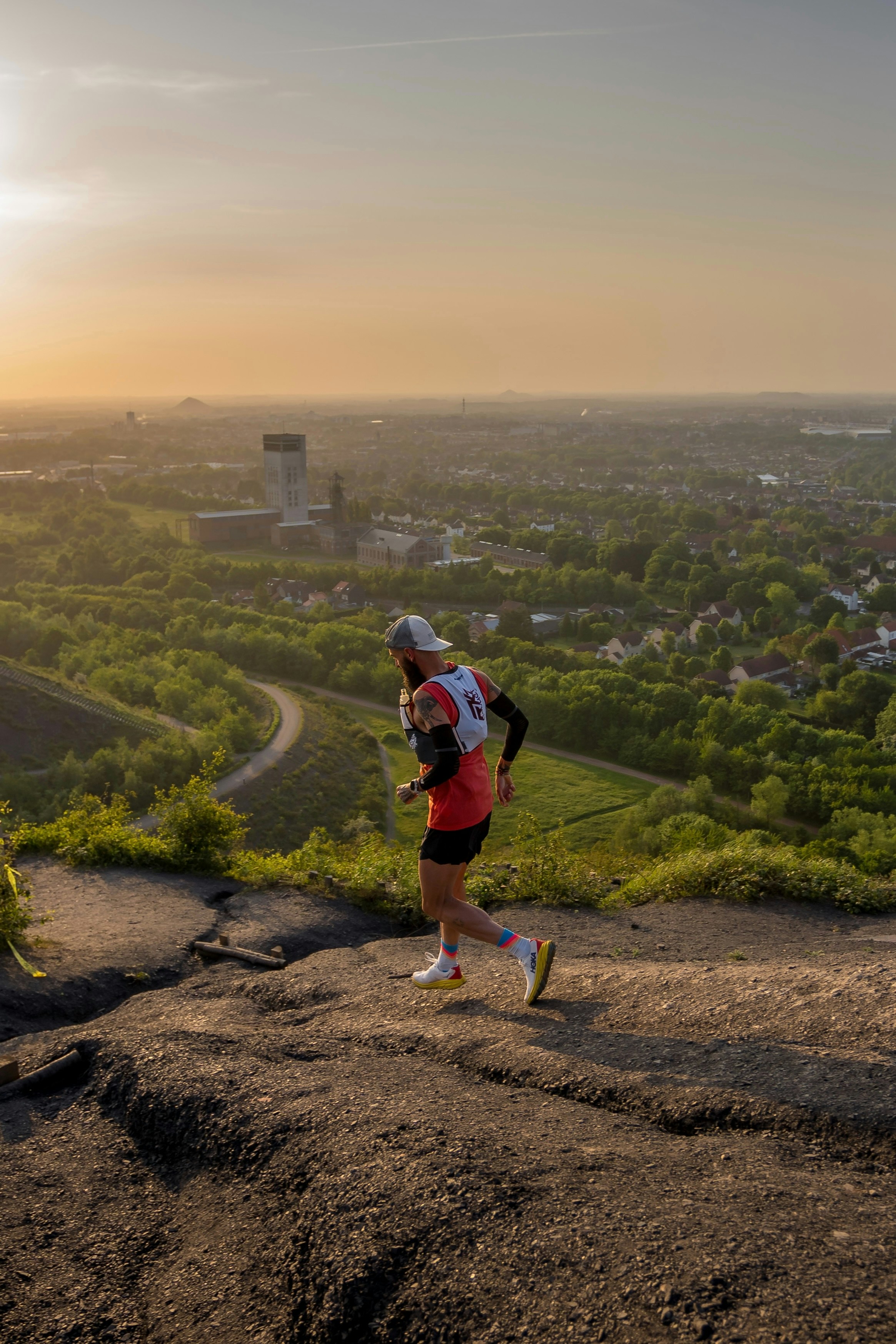 A man running up a hill at sunset photo – Free Loos-en-gohelle Image on ...