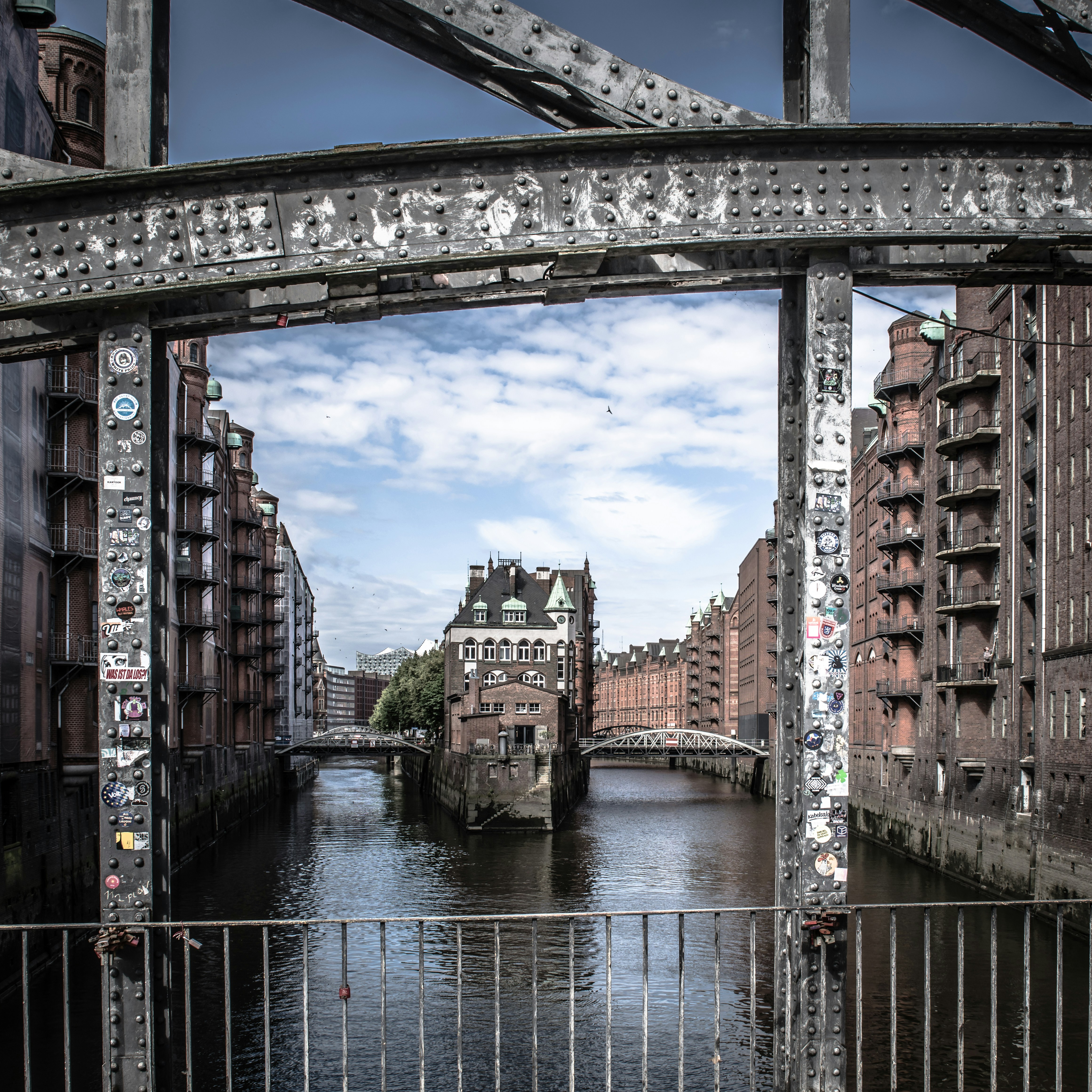 A bridge over a river next to tall buildings photo – Free Panorama ...