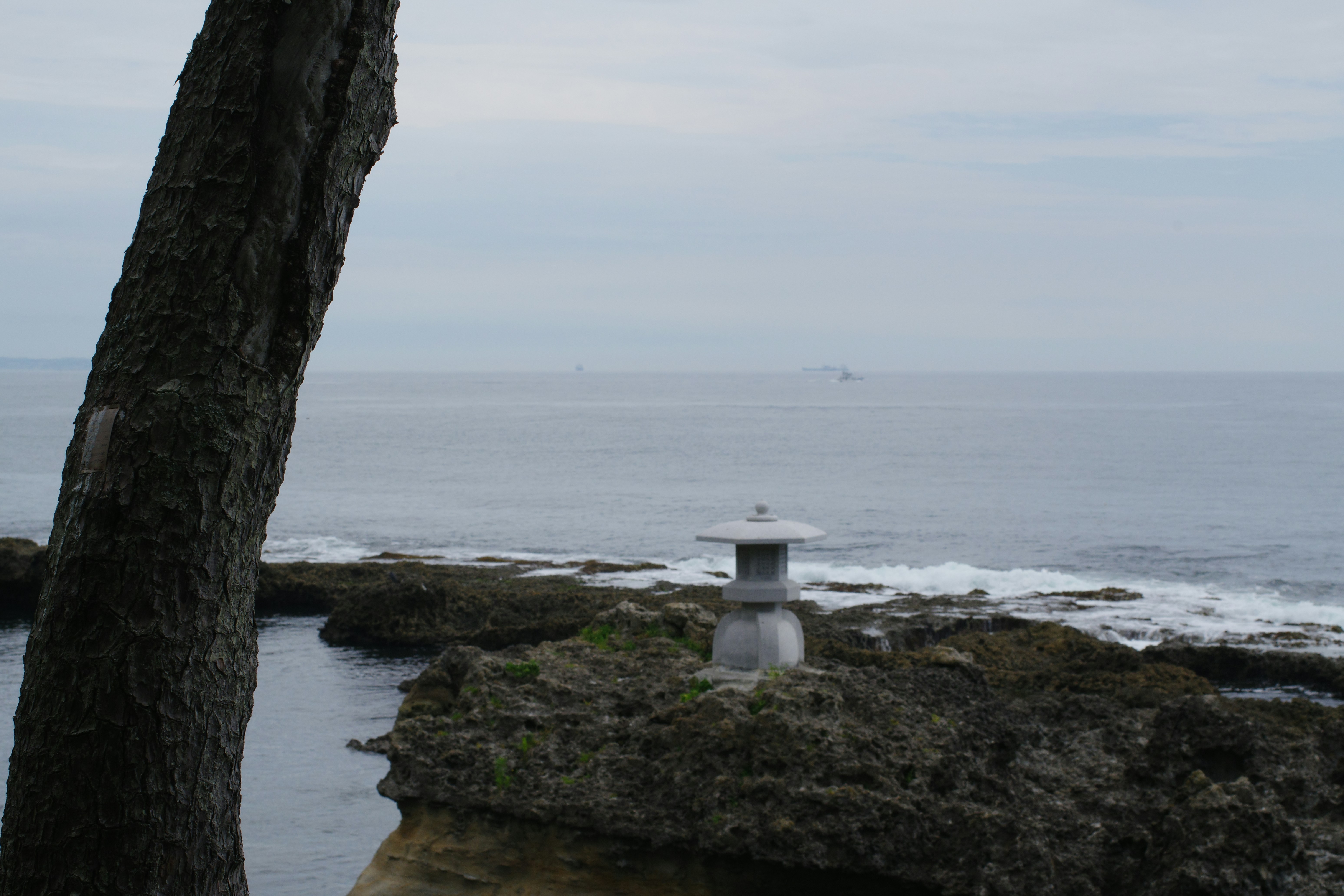 Stone Lantern at the Quiet Edge of a Rocky Seaboard