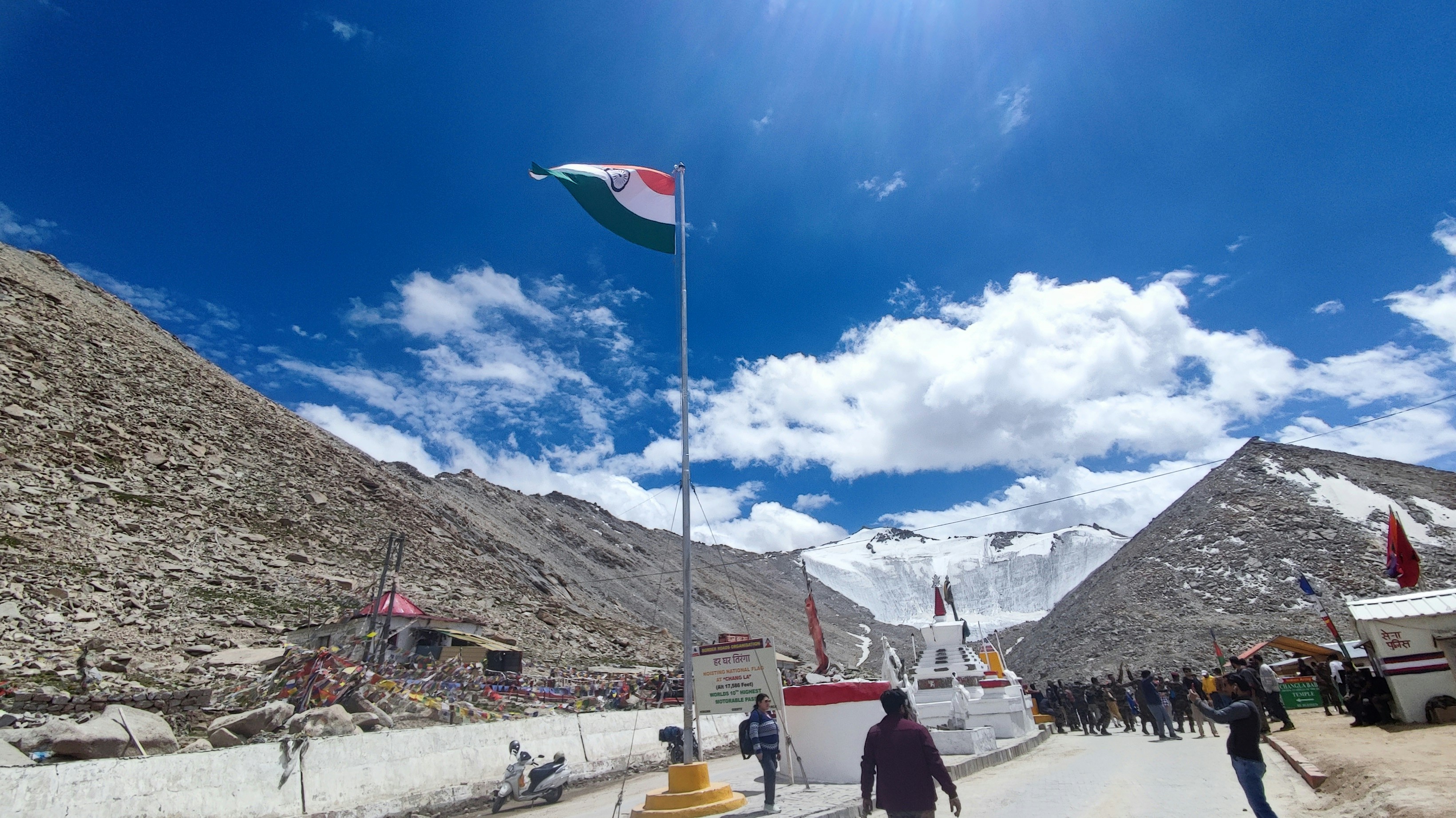 Flagpole at a Himalayan Pass Bazaar Beneath a Cerulean Sky