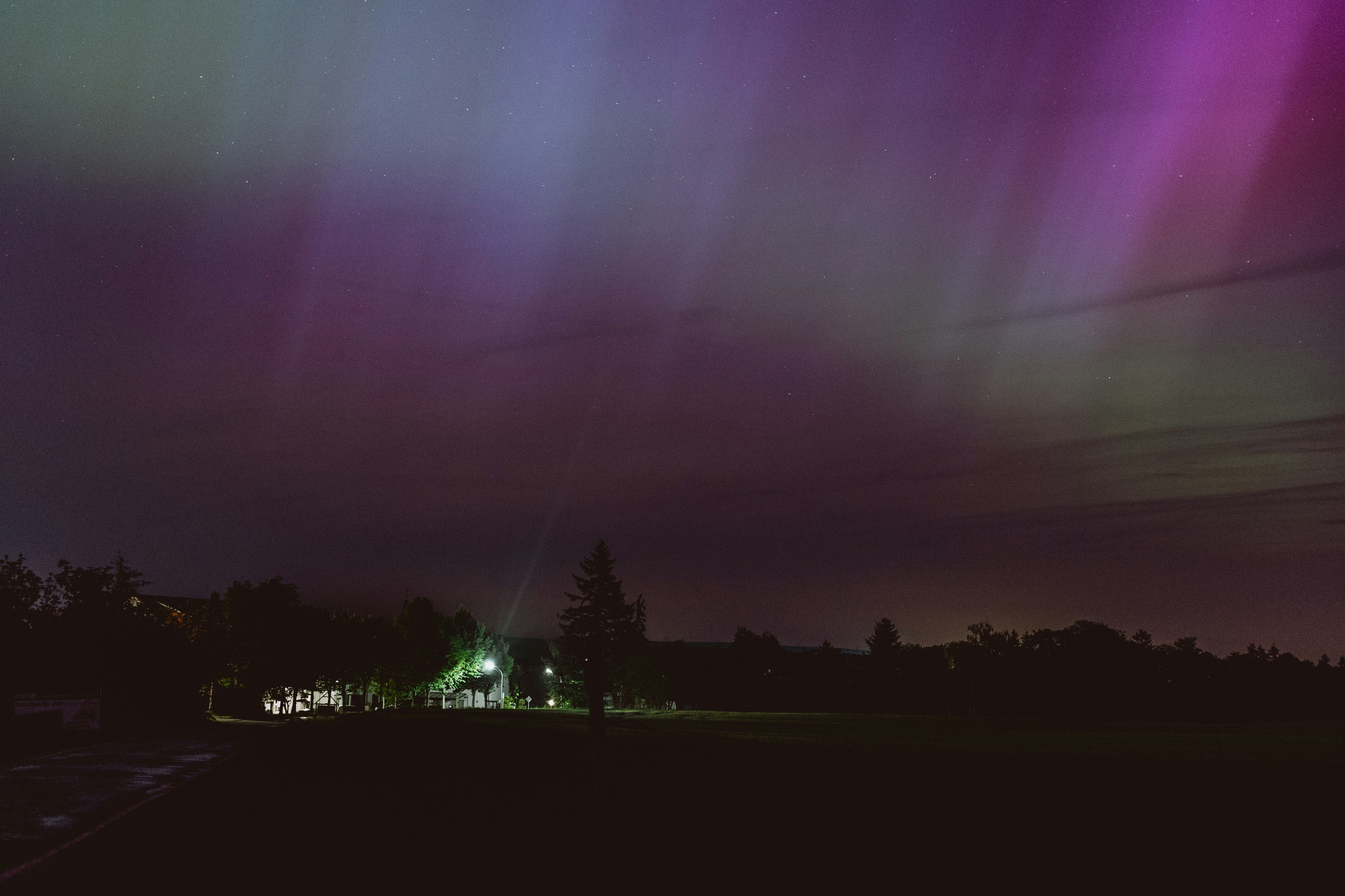 Aurora Veils Over a Quiet Rural Field