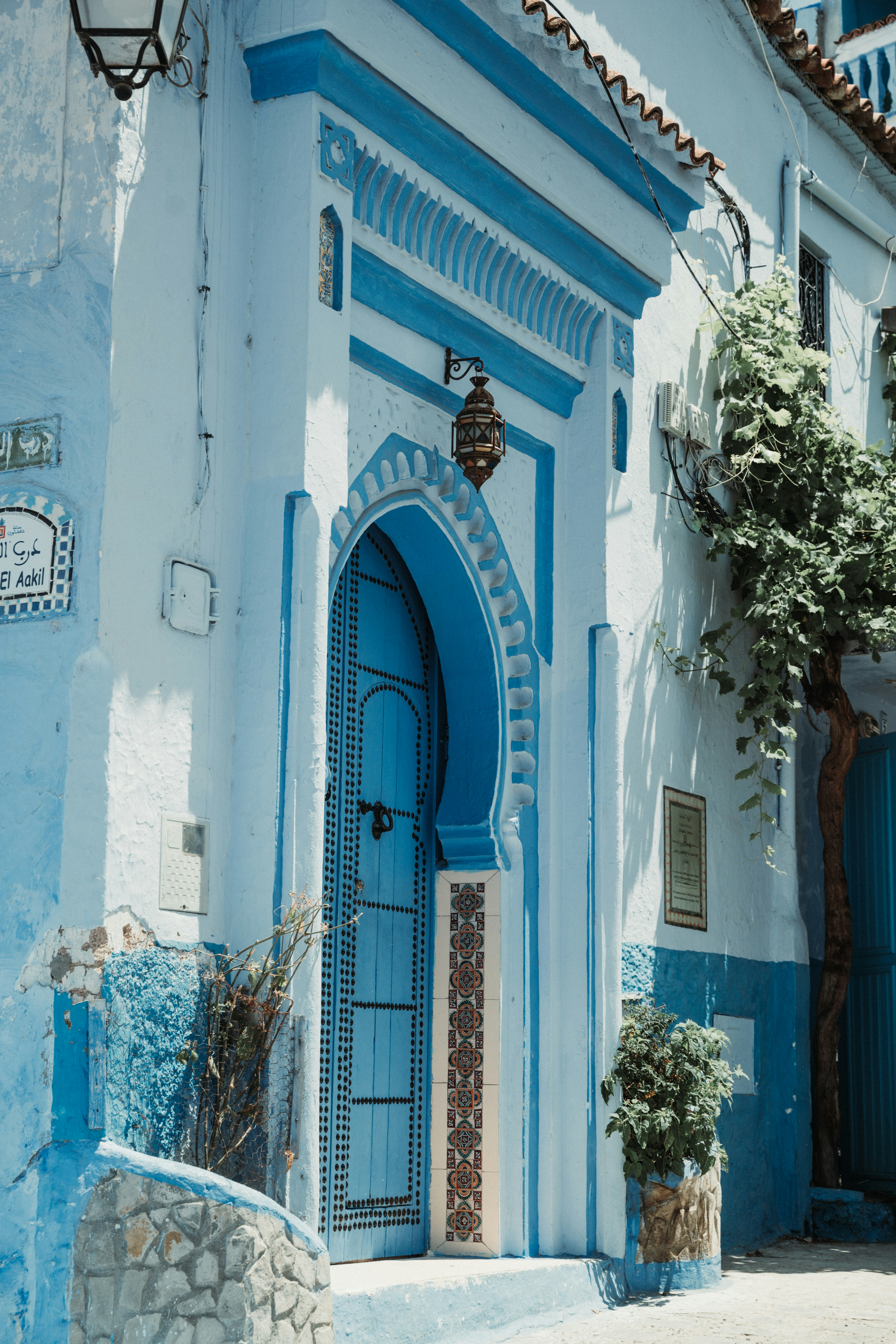 A blue and white building with a blue door