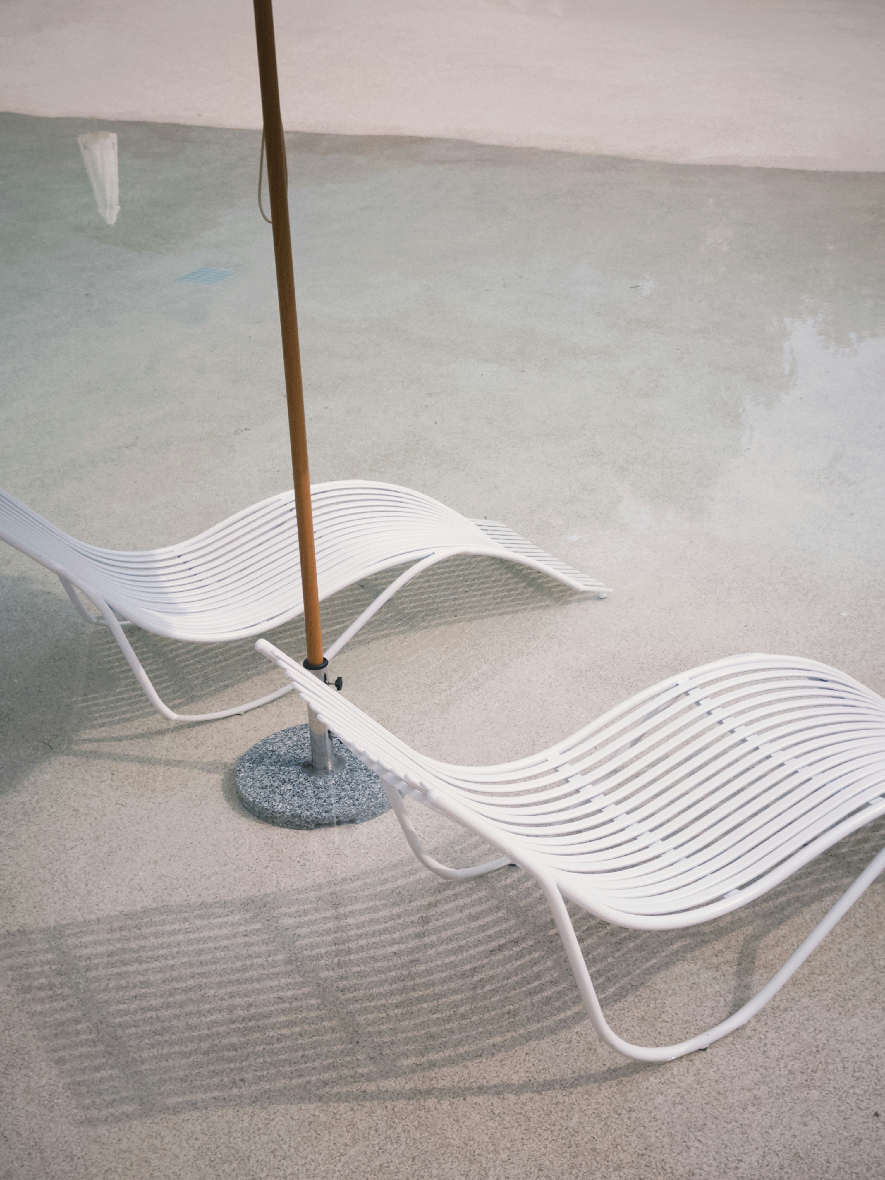 Serpentine Lounge under a Wooden Umbrella