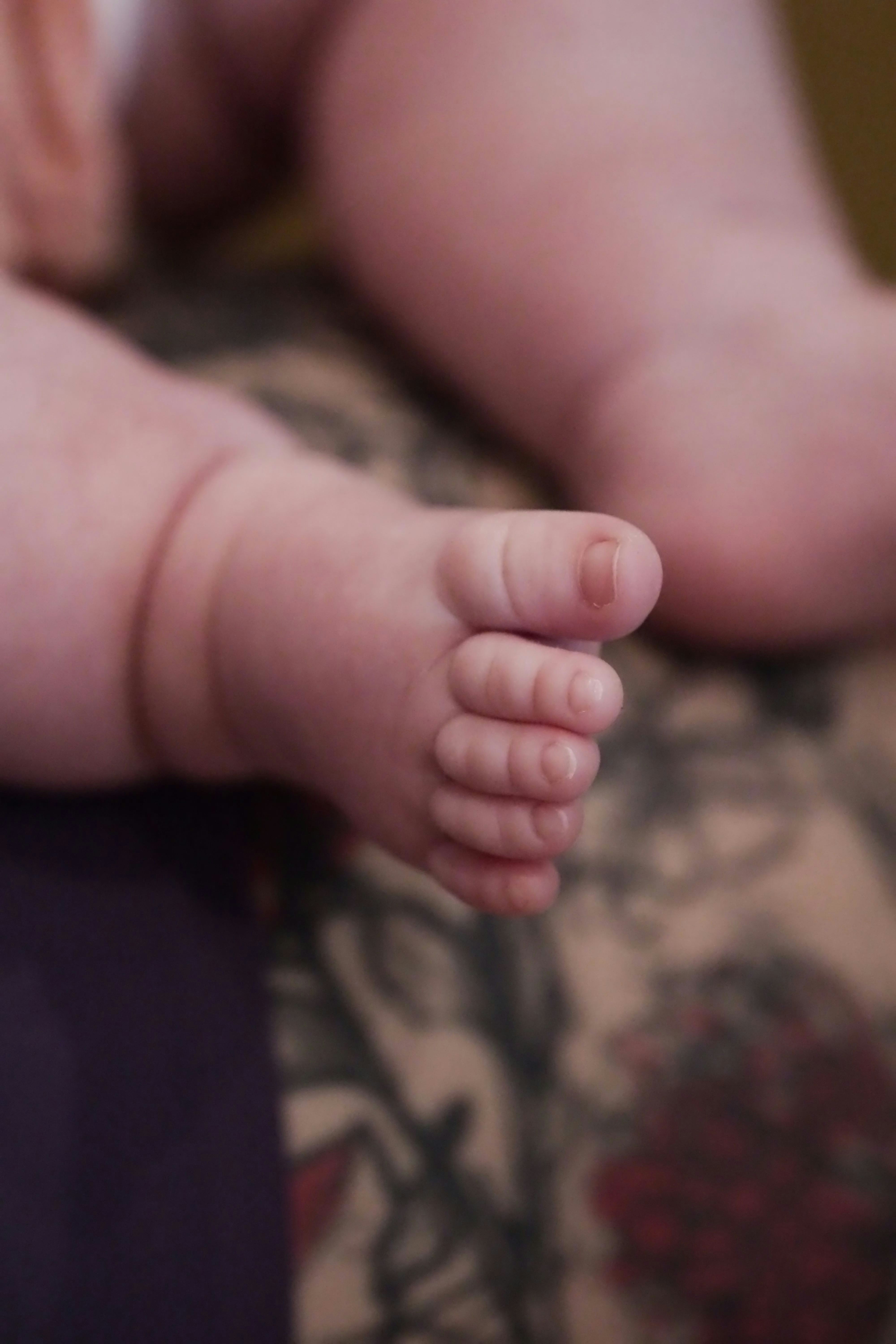 Tender Toes in Soft Focus: A Newborn's Quiet Footprint