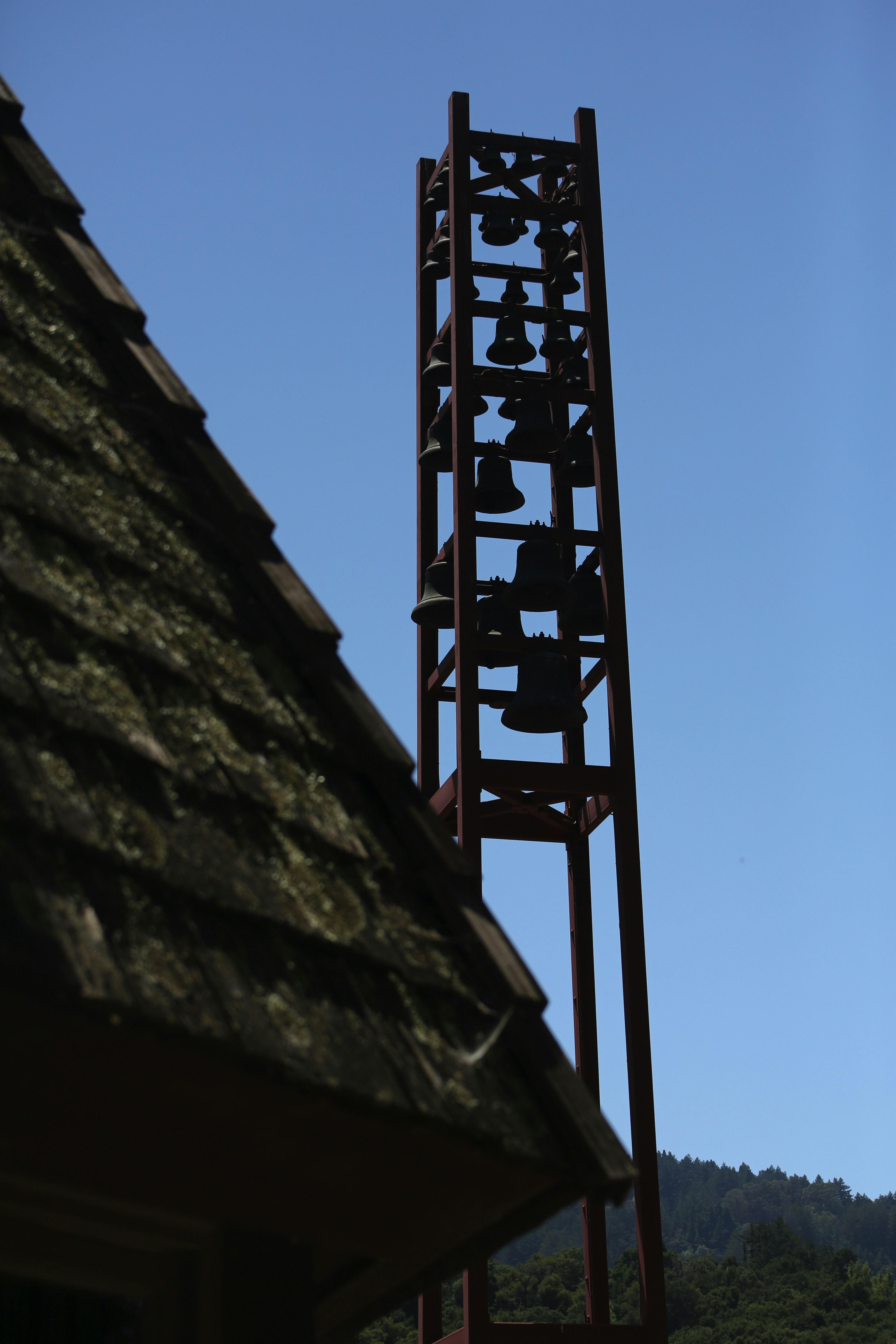 Iron Belfry Reaching Toward a Clear Blue Sky