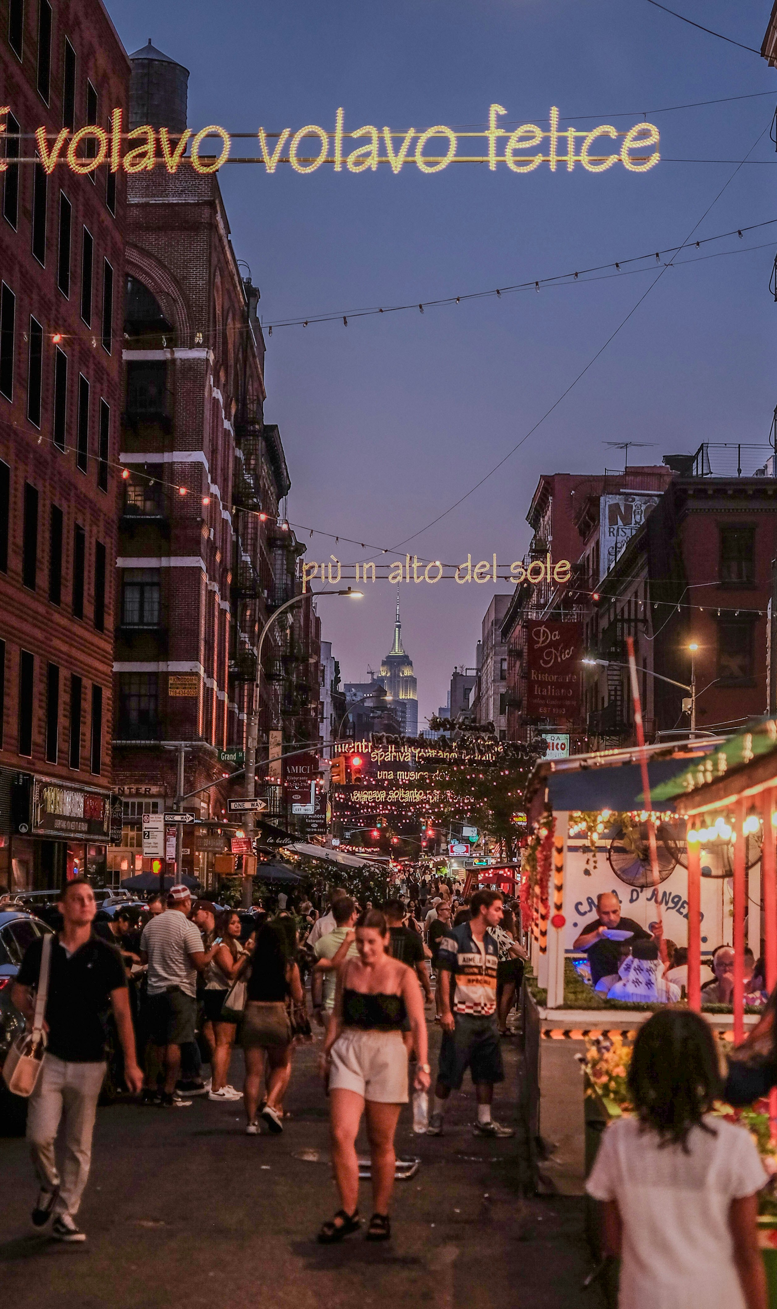 Neon Threads Over a Bustling Dusk Street Market