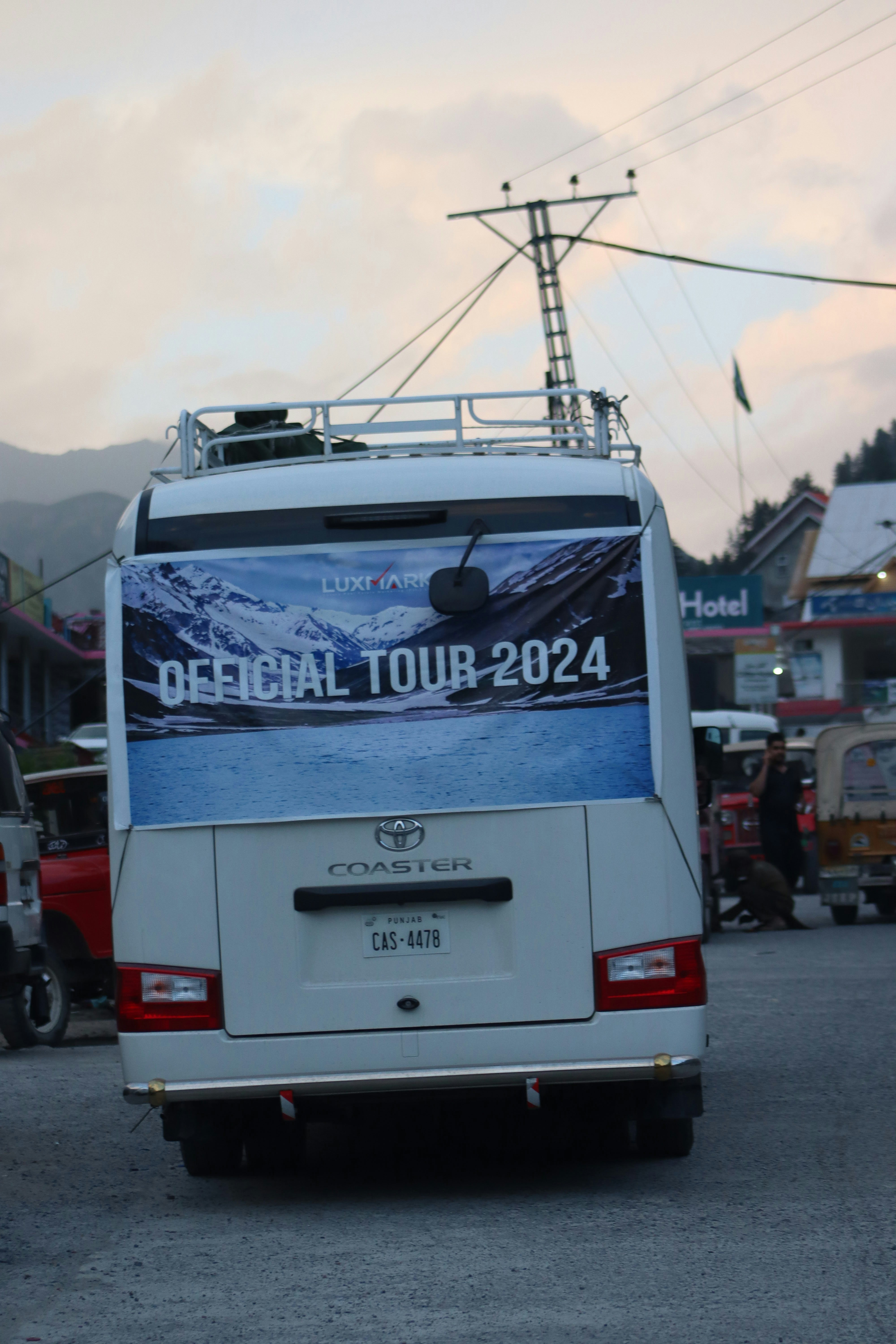 Rear View of Tour Bus Banner: Official Tour 2024