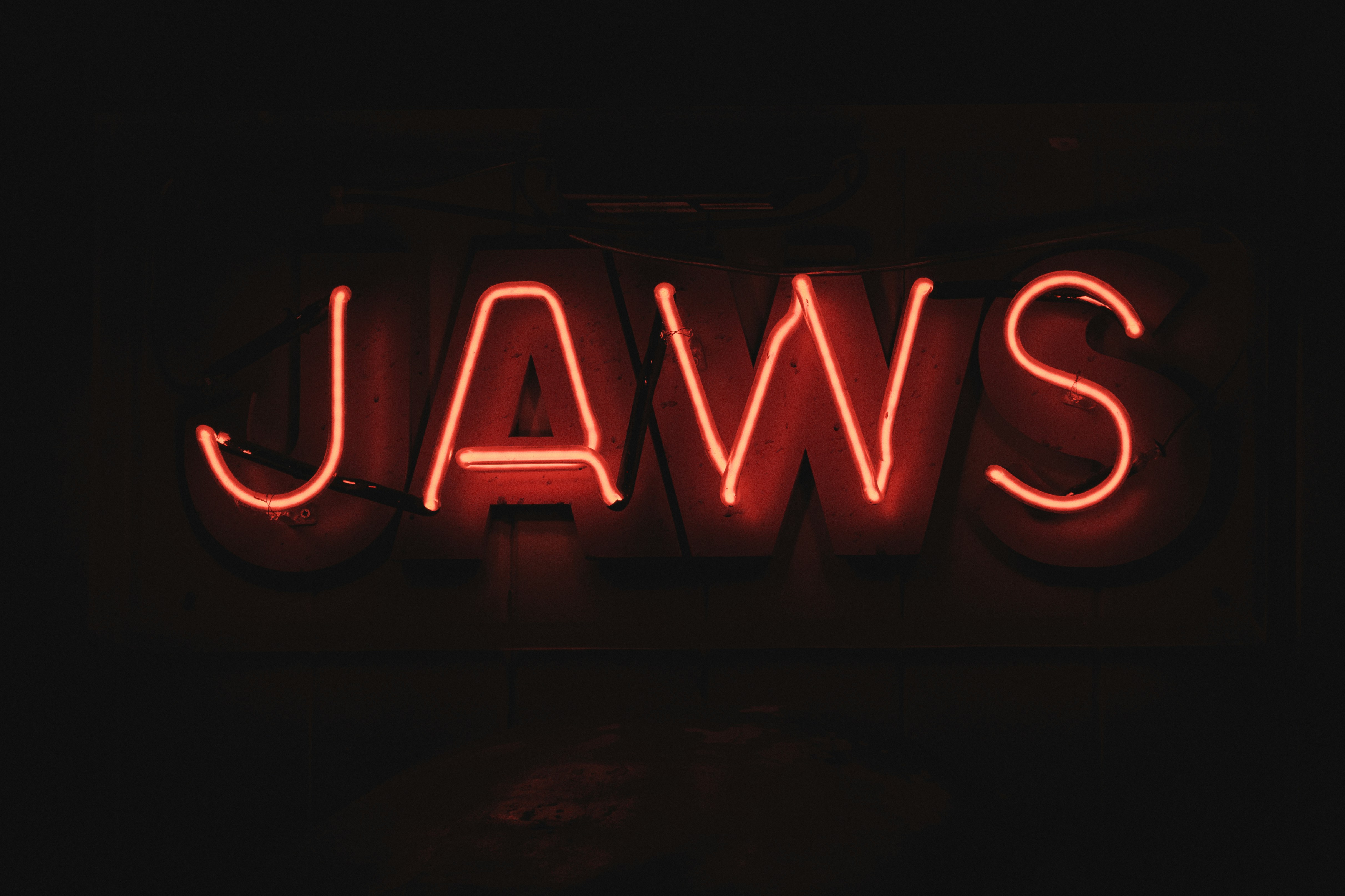 A red neon sign that says jaws photo – Free Neon sign Image on Unsplash