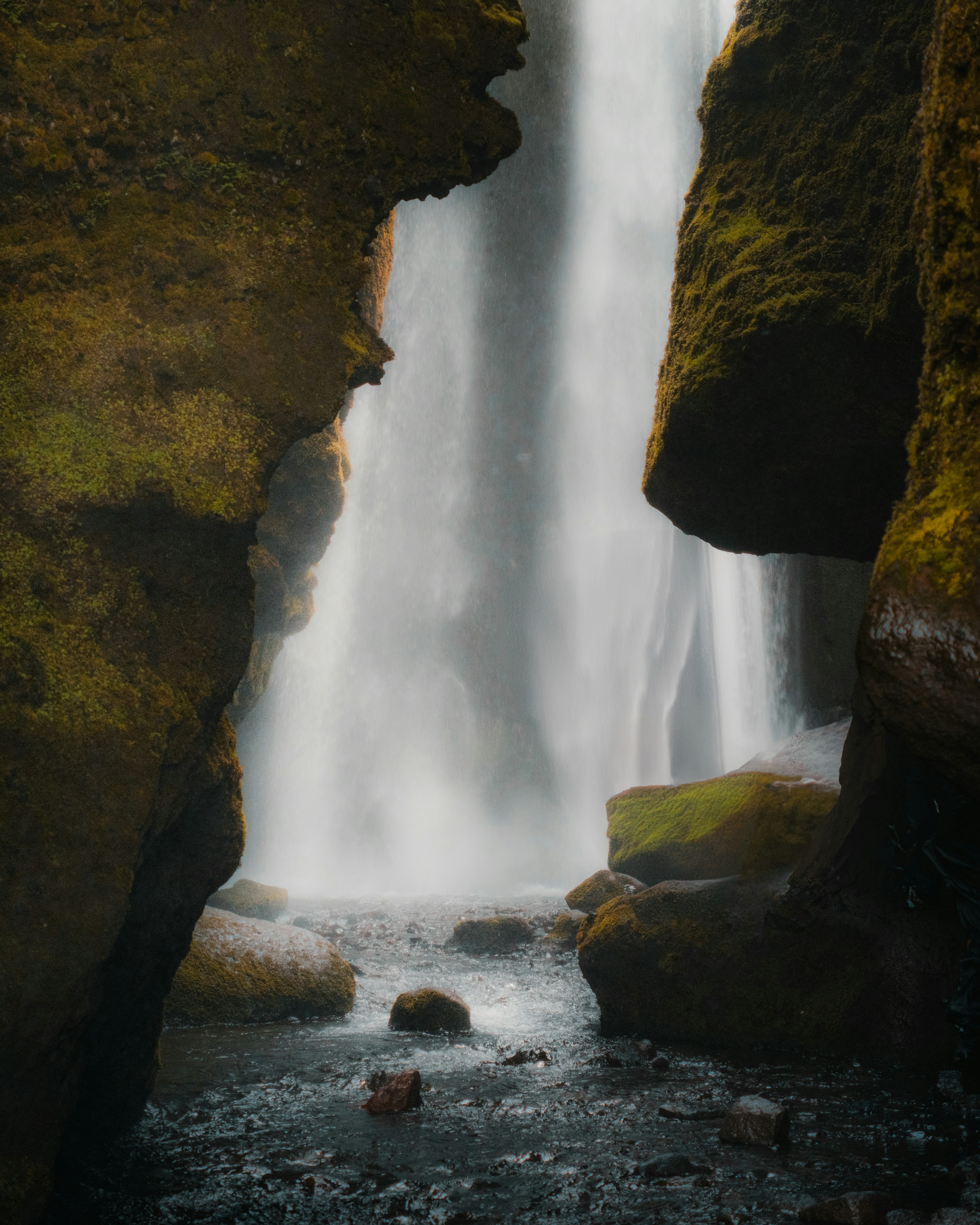 A waterfall is seen from the inside of a cave photo – Free Nature Image ...