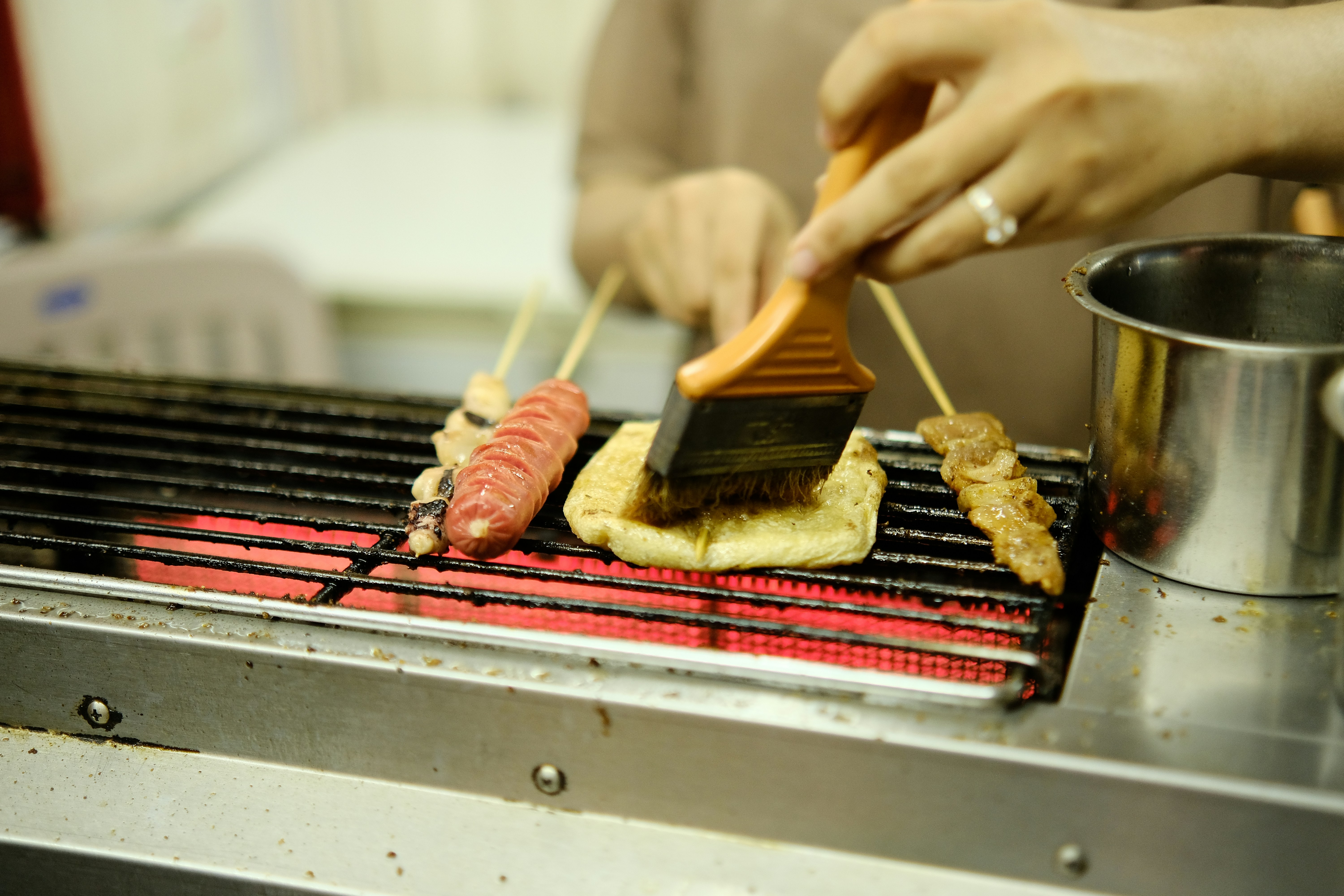 Brush and Skewers: Sauce in Motion over Red Coals