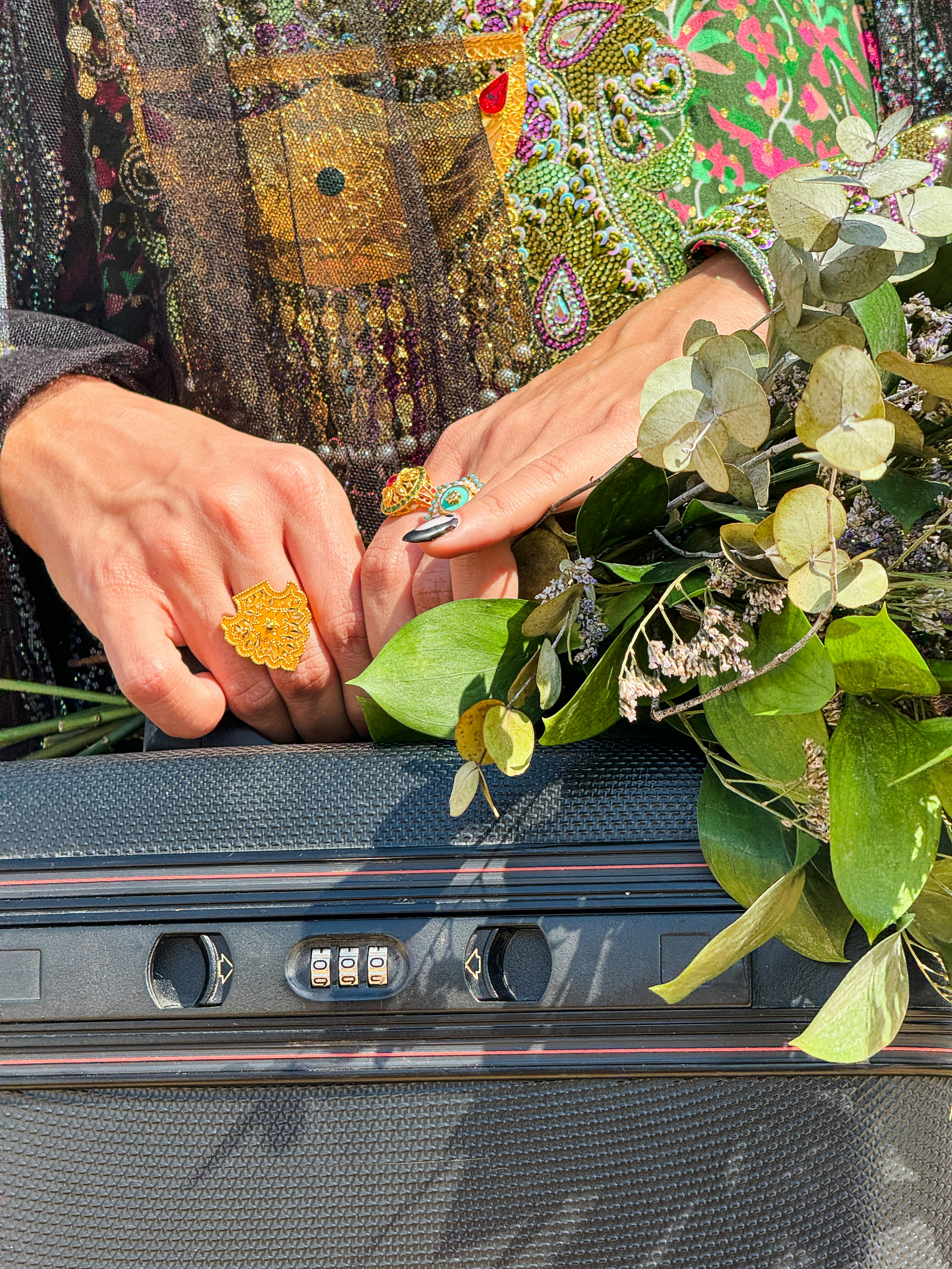 Gilded Ring and Verdant Bouquet Cradled on a Textured Surface