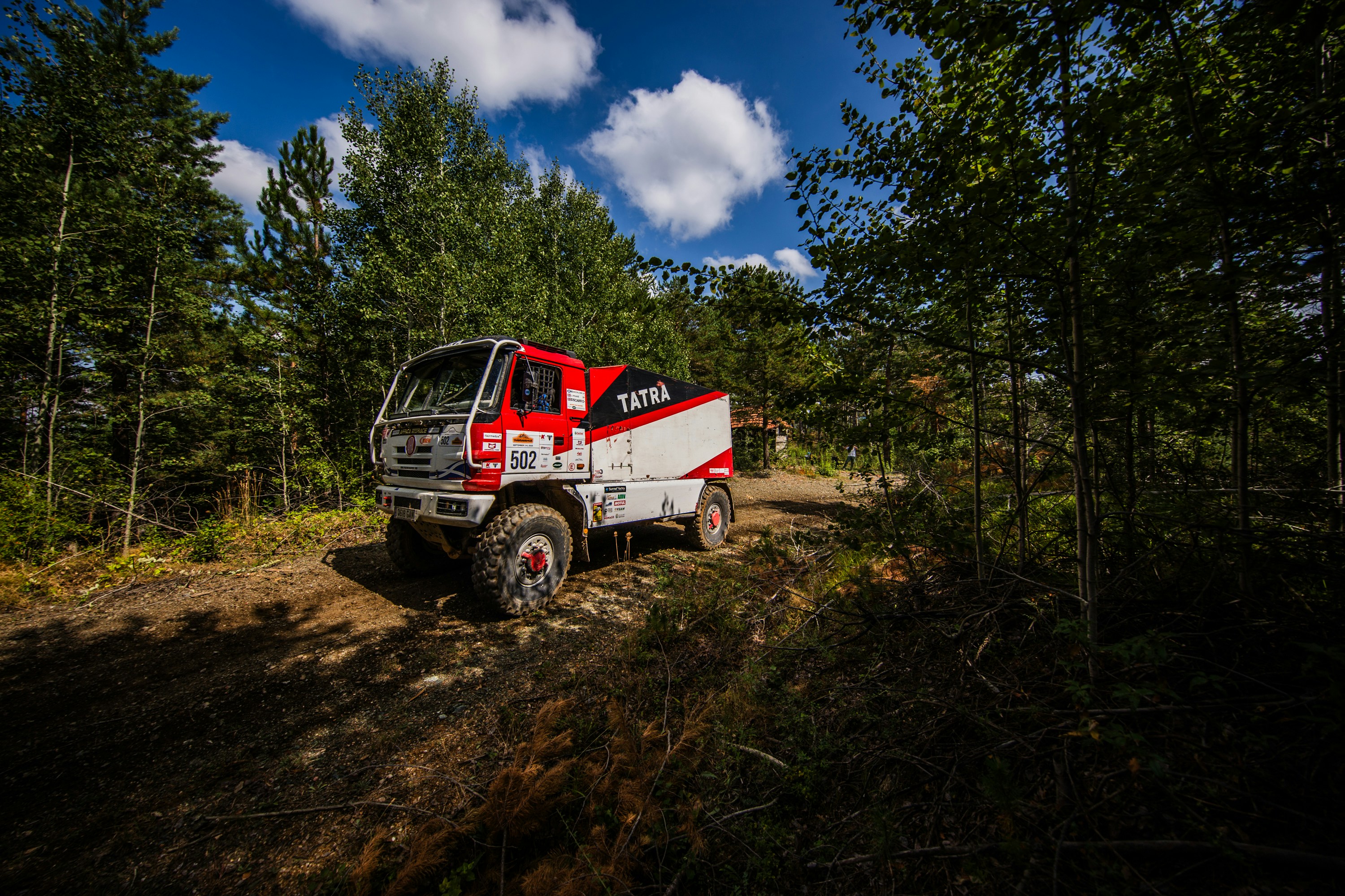 Crimson Tatra on a Forest Dirt Road